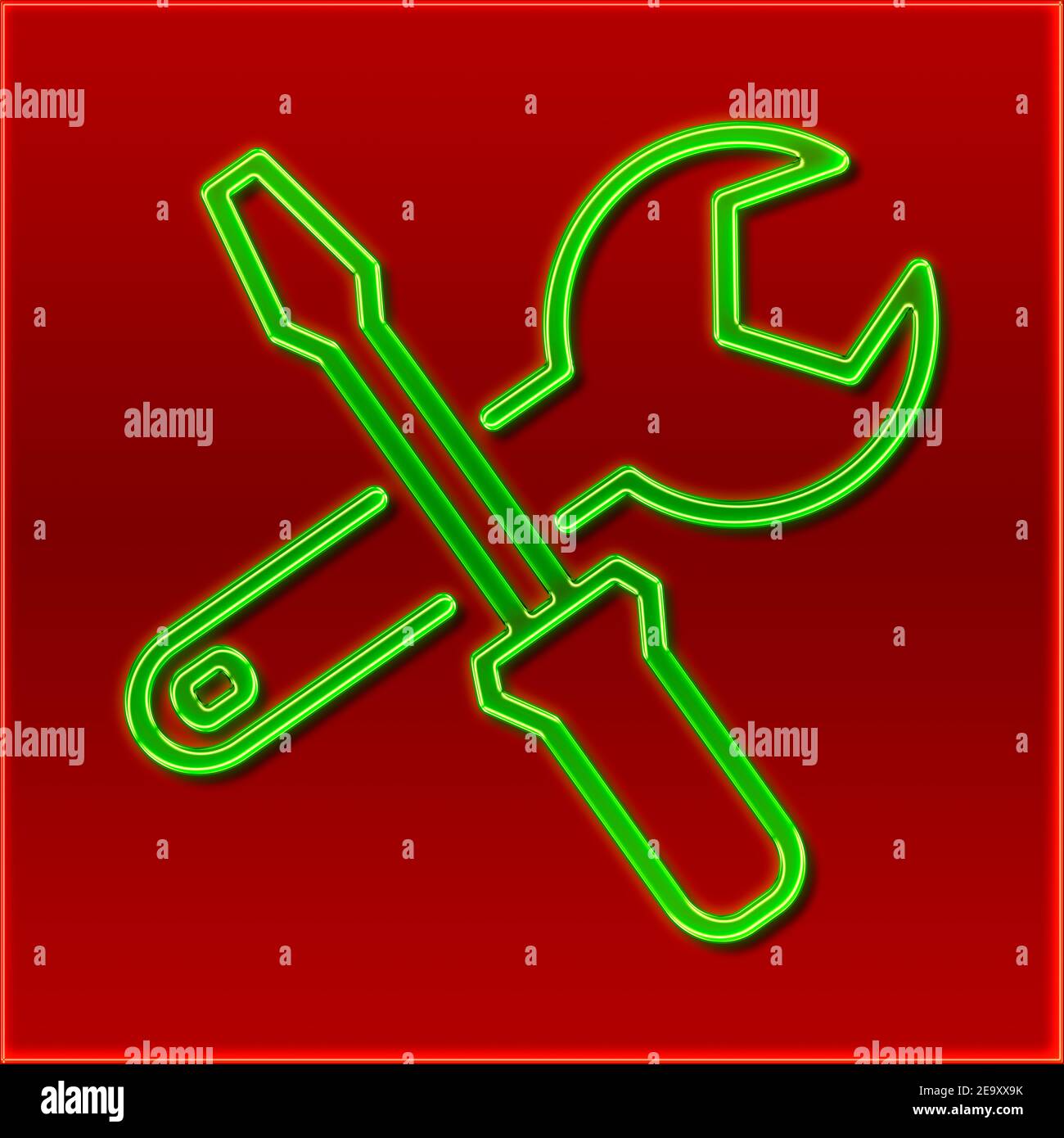 A screwdriver and an open-ended spanner lie crossed over each other ...