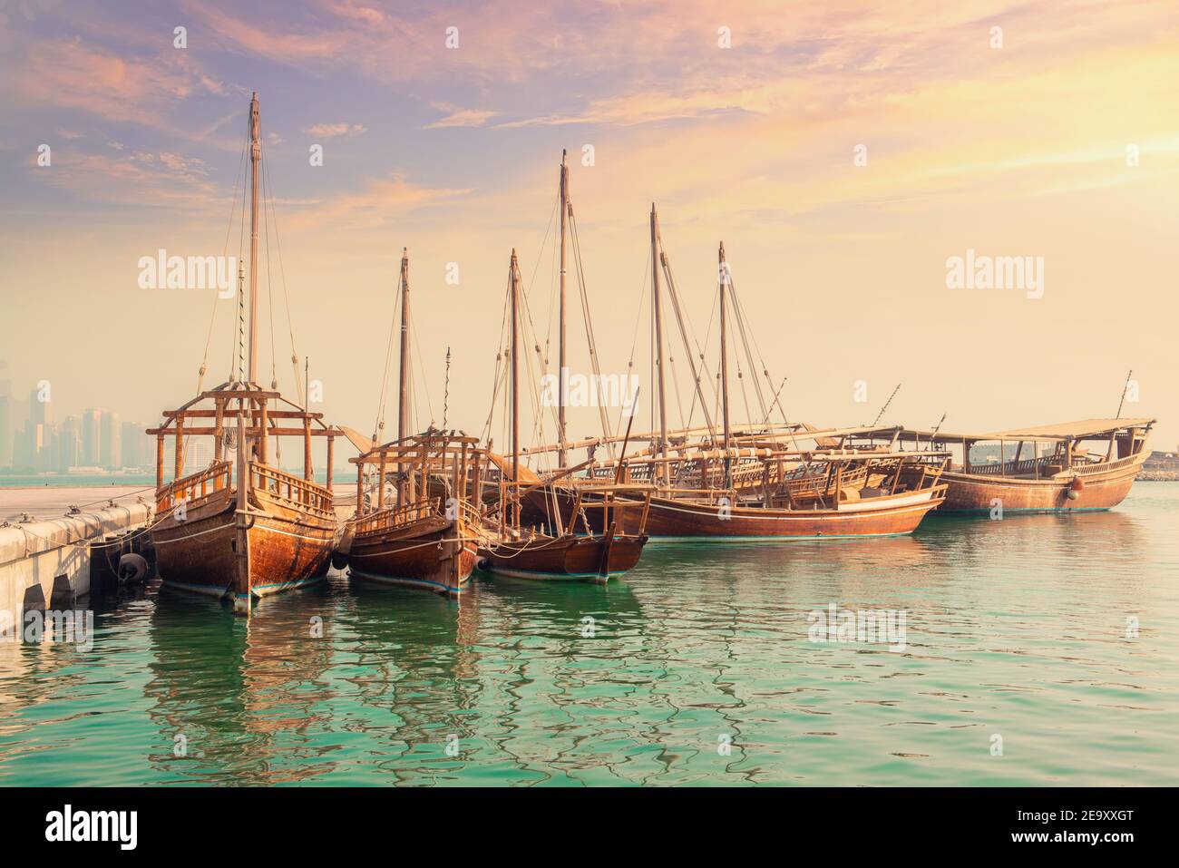 Traditional boats called Dhows are anchored in the port near Museum of ...
