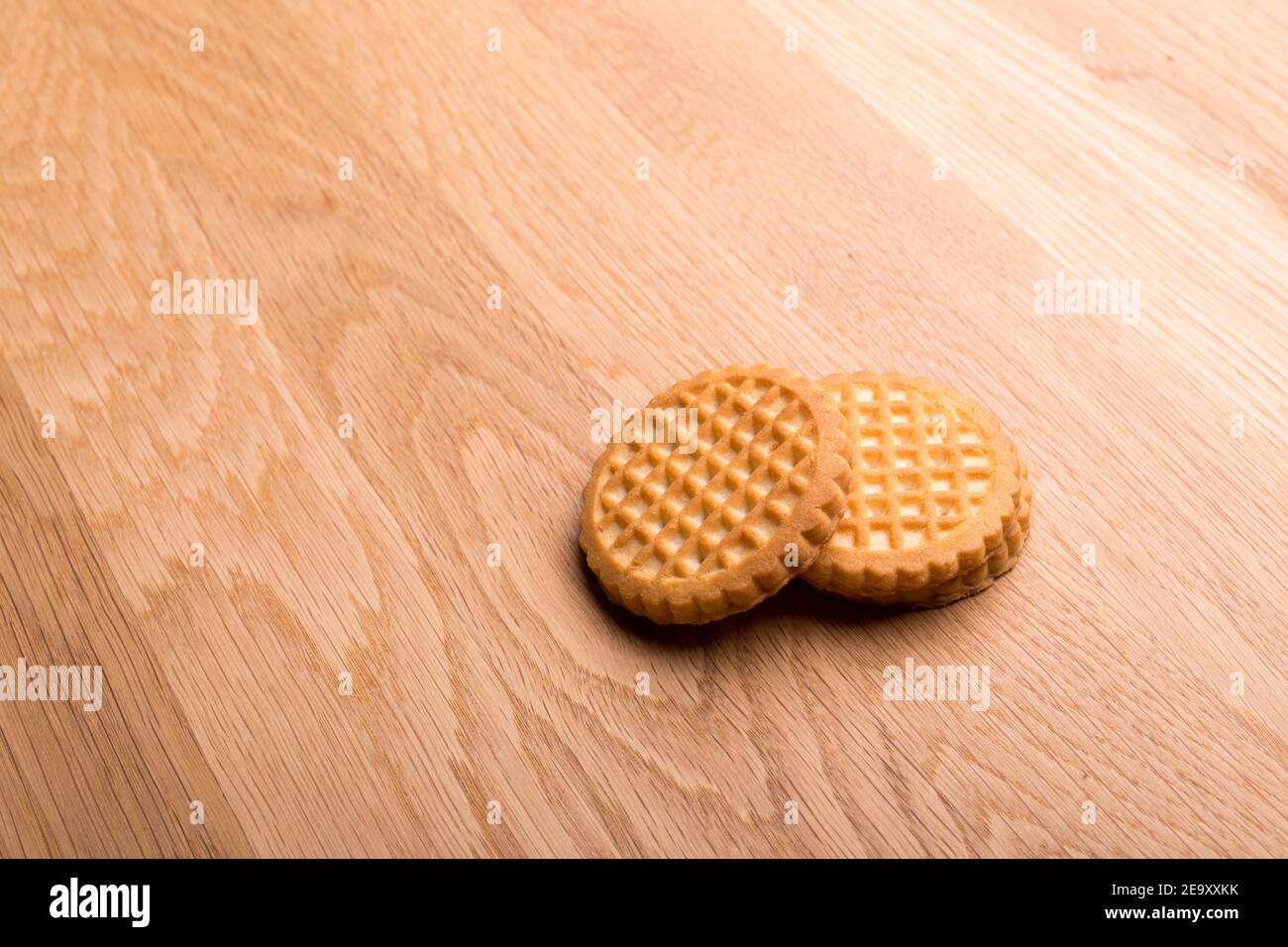 pile of butter biscuits on a oak wooden table, close up Stock Photo - Alamy