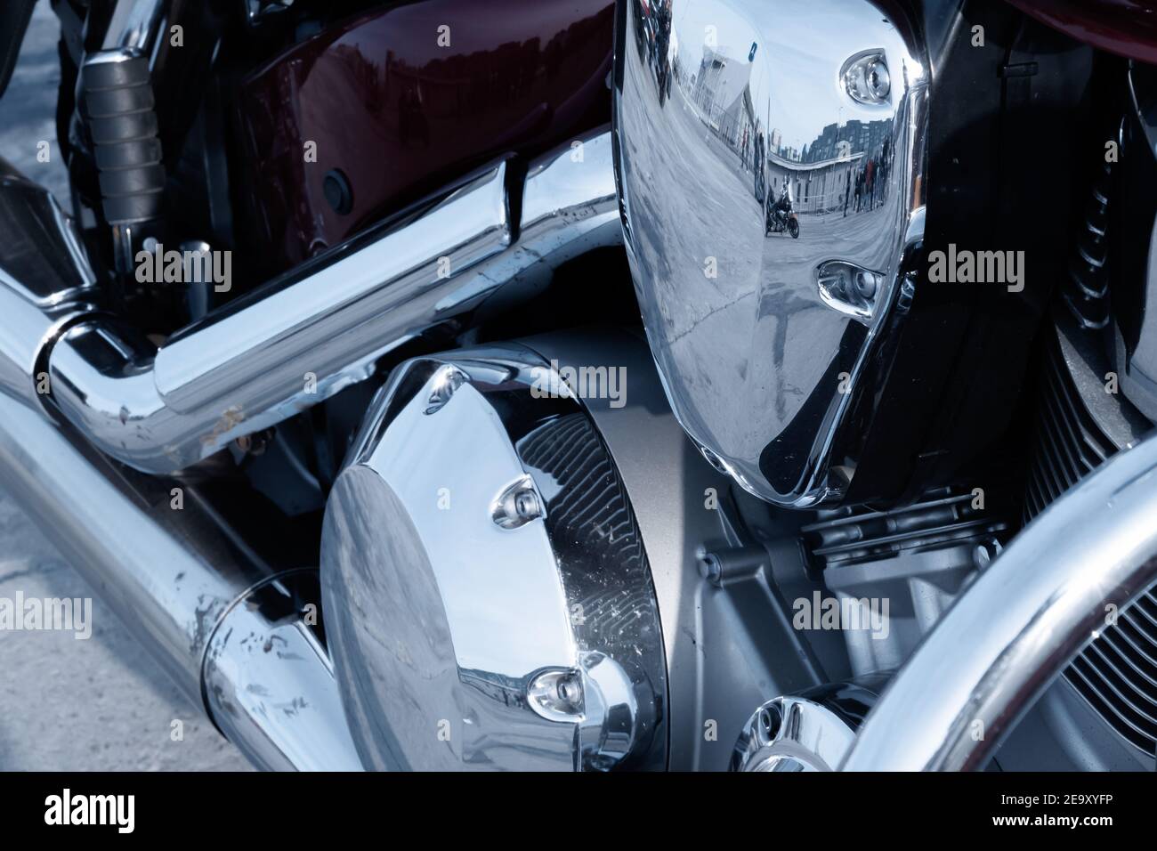 A modern powerful road bike with a shiny chrome reflective engine ...