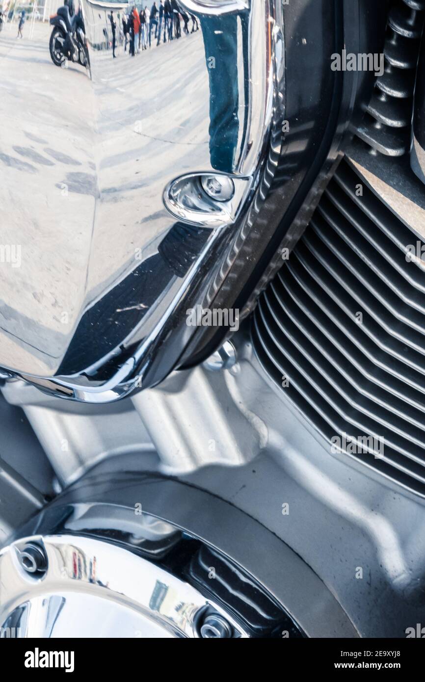 Close-up of a motorcycle engine with chrome details and reflective ...