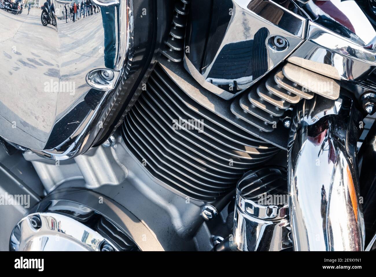Close-up of a motorcycle engine with chrome details and reflective ...