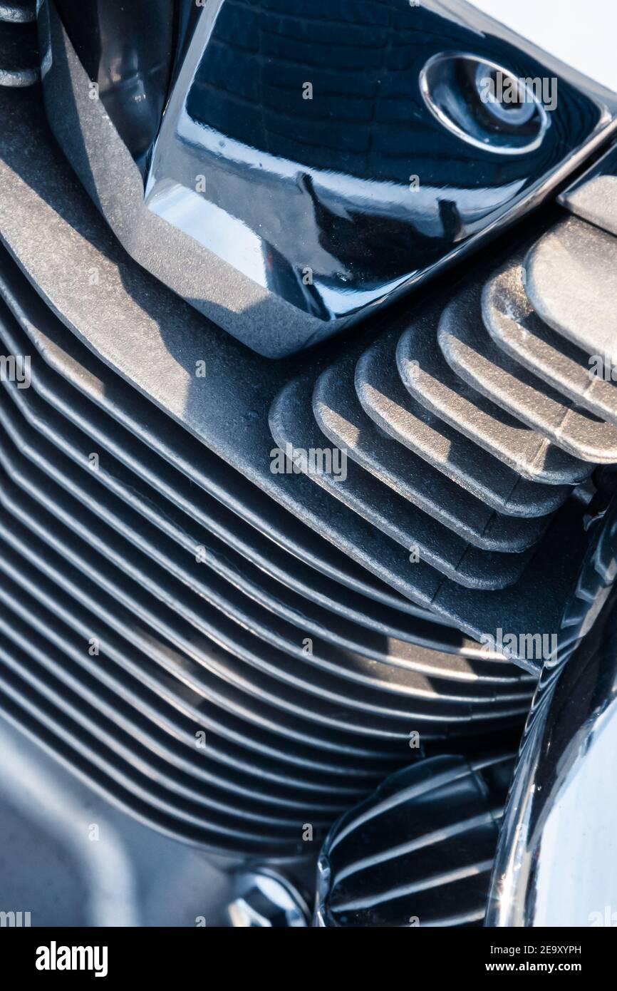 Close-up of a powerful motorcycle engine block with chrome-plated parts ...