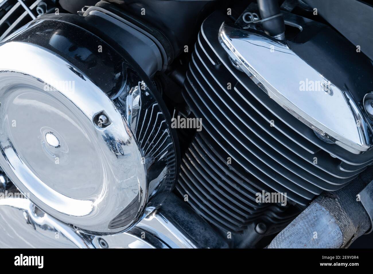 Close-up of a powerful motorcycle engine block with chrome-plated parts ...