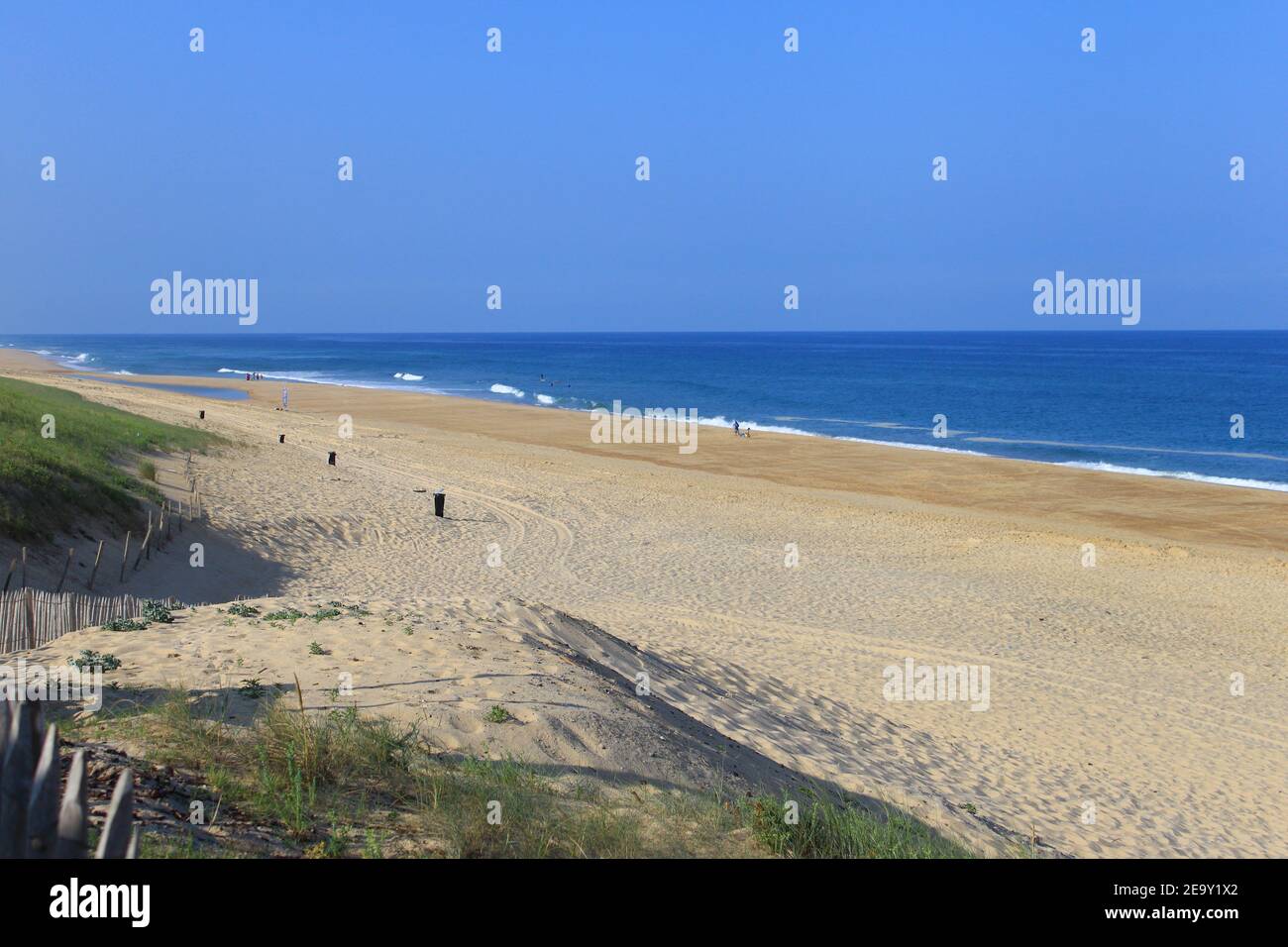 Sandy beach in France, blue water nice sky Stock Photo - Alamy