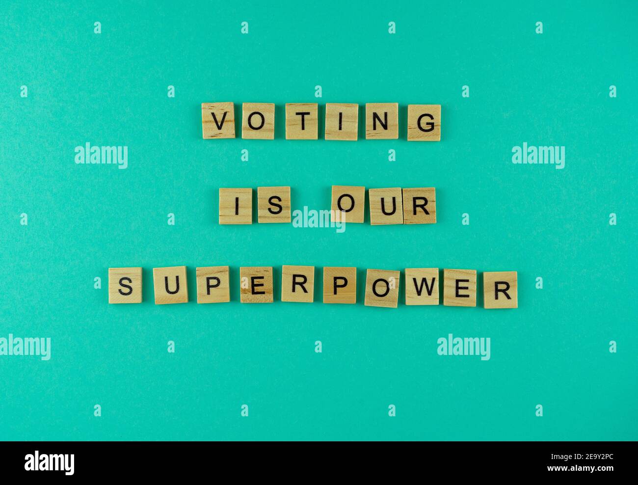 Words voting is our superpower. The phrase is laid out in wooden ...