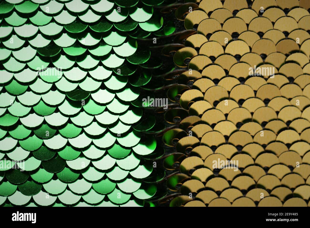 Sequins background Green and gold sequins half background. vibrant ...