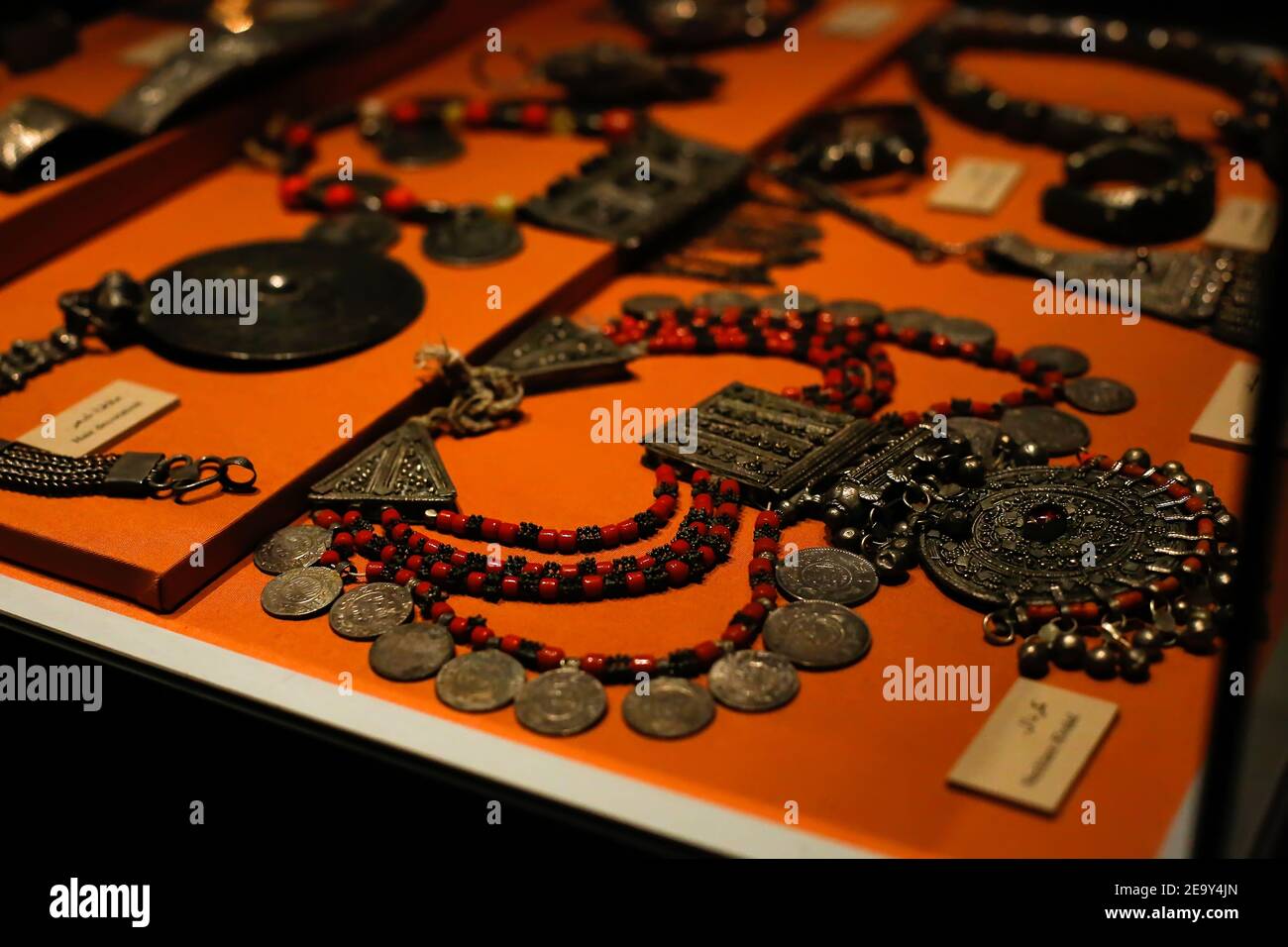 Orange display with traditional ancient arabic emirati metal jewelry ...