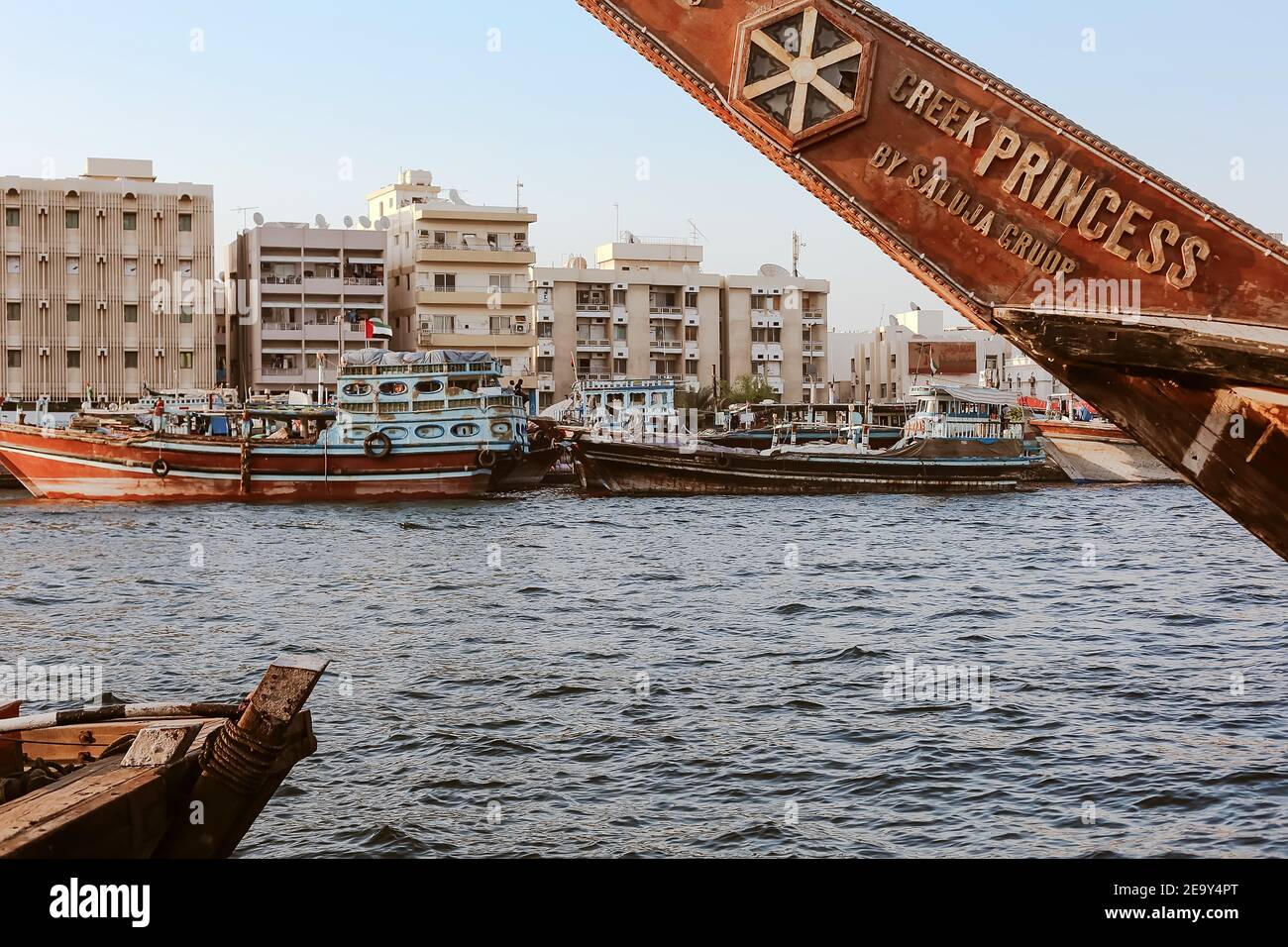 Dubai Creek harbor with water bay and old wooden abra boats Stock Photo ...