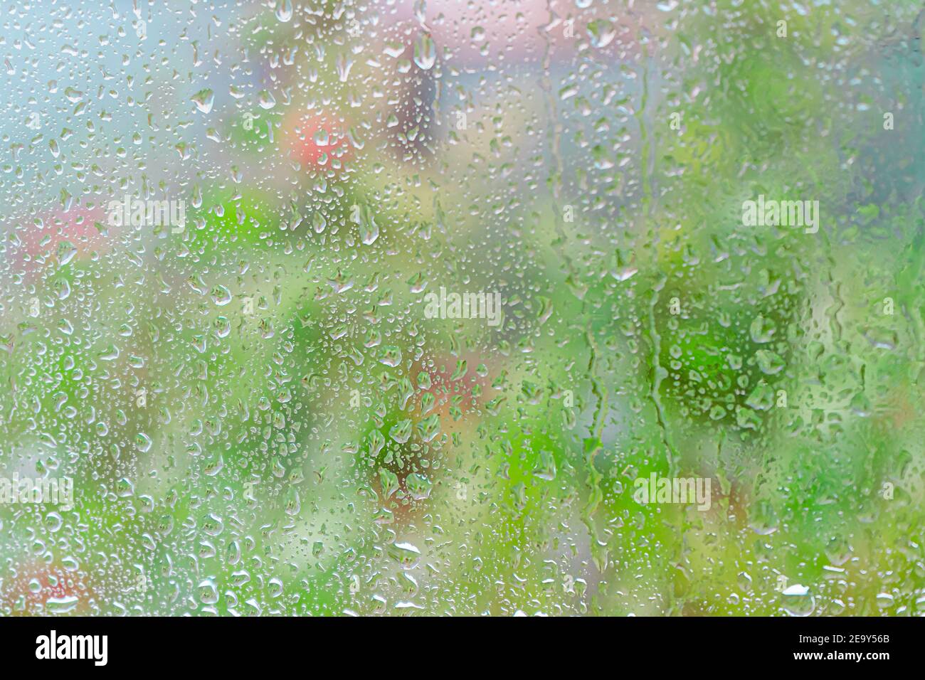 Spring background with rain drops on the window. Natural texture ...