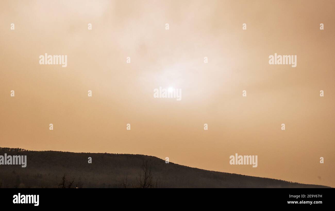 Sun in the sky covered by Sahara dust particles Stock Photo - Alamy