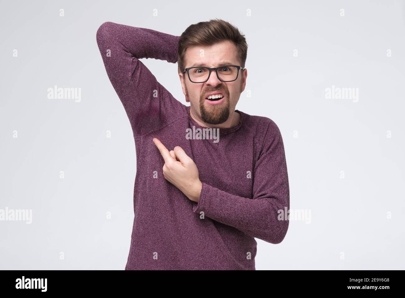 Mature caucasian man with sweating armpit. Hyperthyroidism concept ...