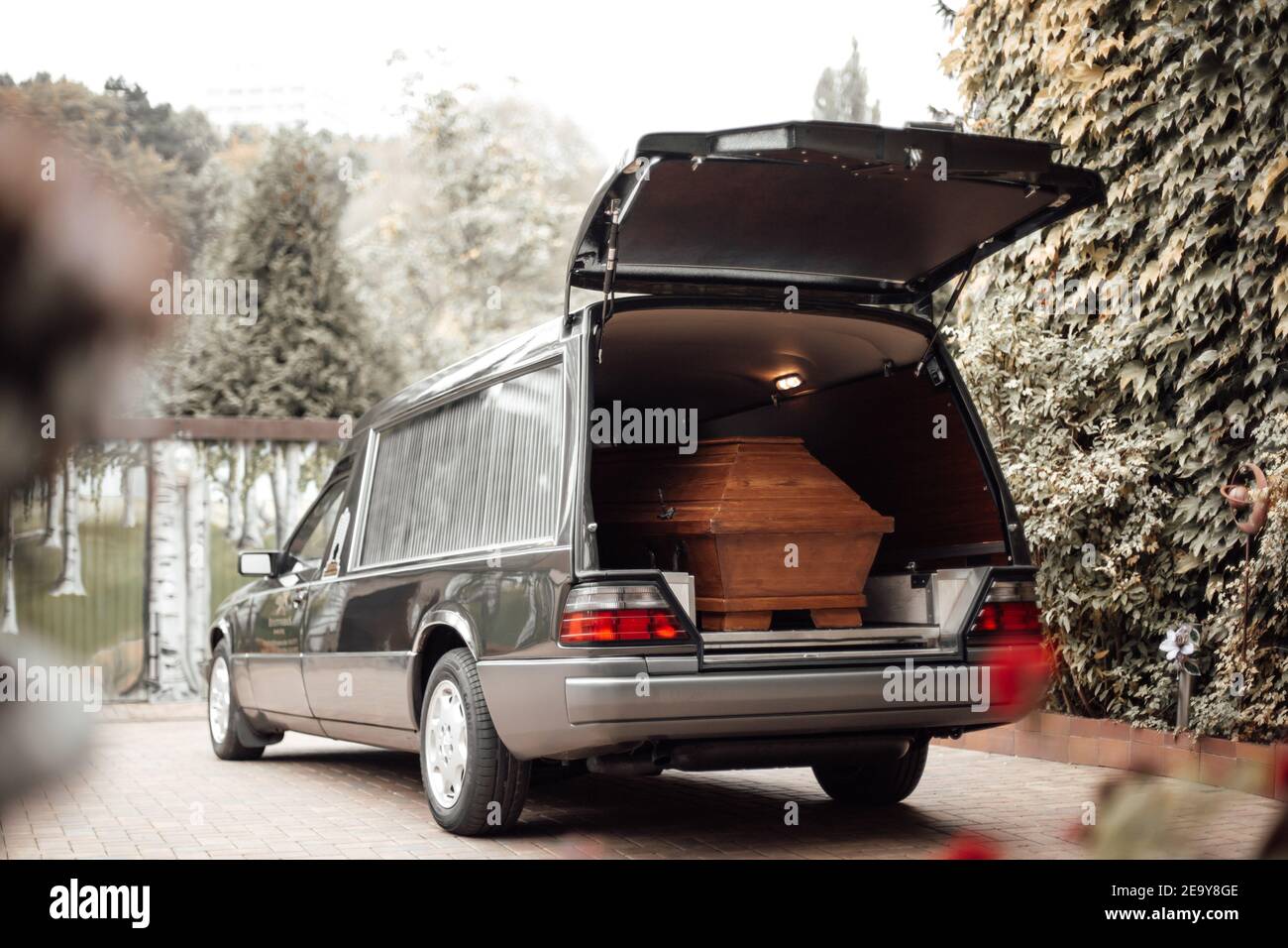 wooden coffin in the back of a car at the crematory Stock Photo - Alamy