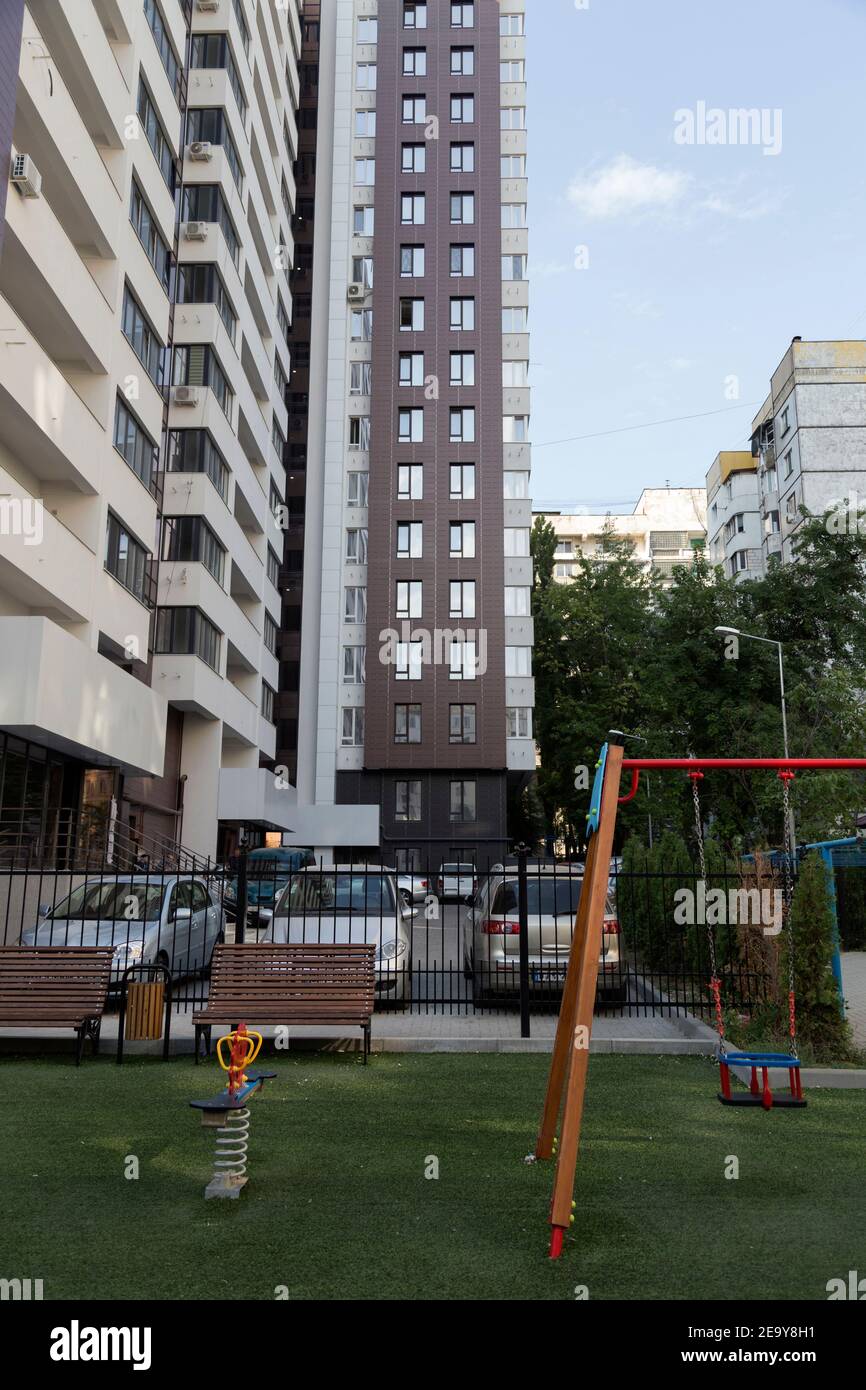 Modern courtyard in the new housing building. Colourful playground for ...