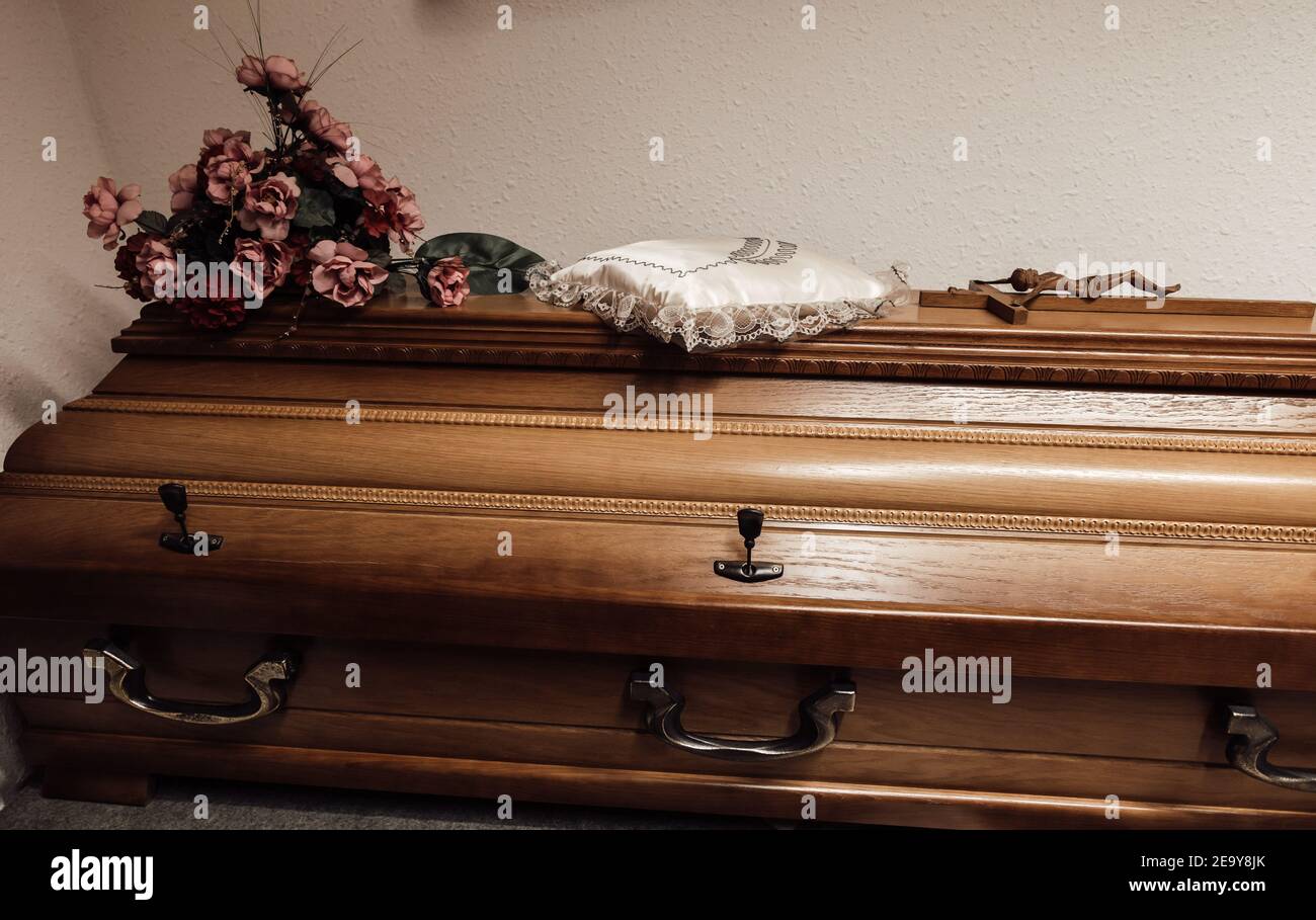 photo of a wooden coffin in a church Stock Photo - Alamy