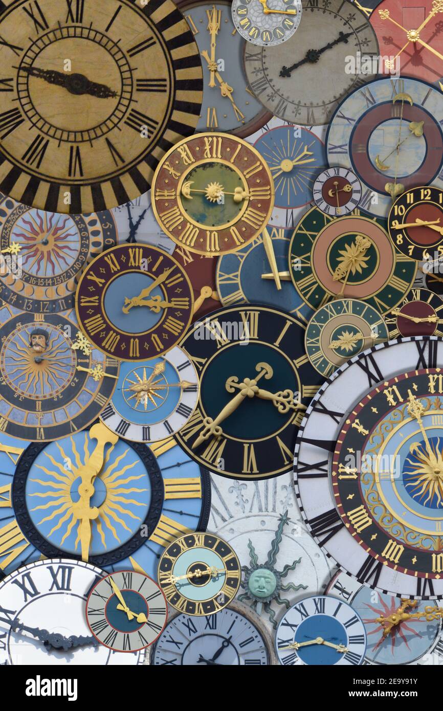 multicolored collection of ancient church tower clocks on a pile in ...