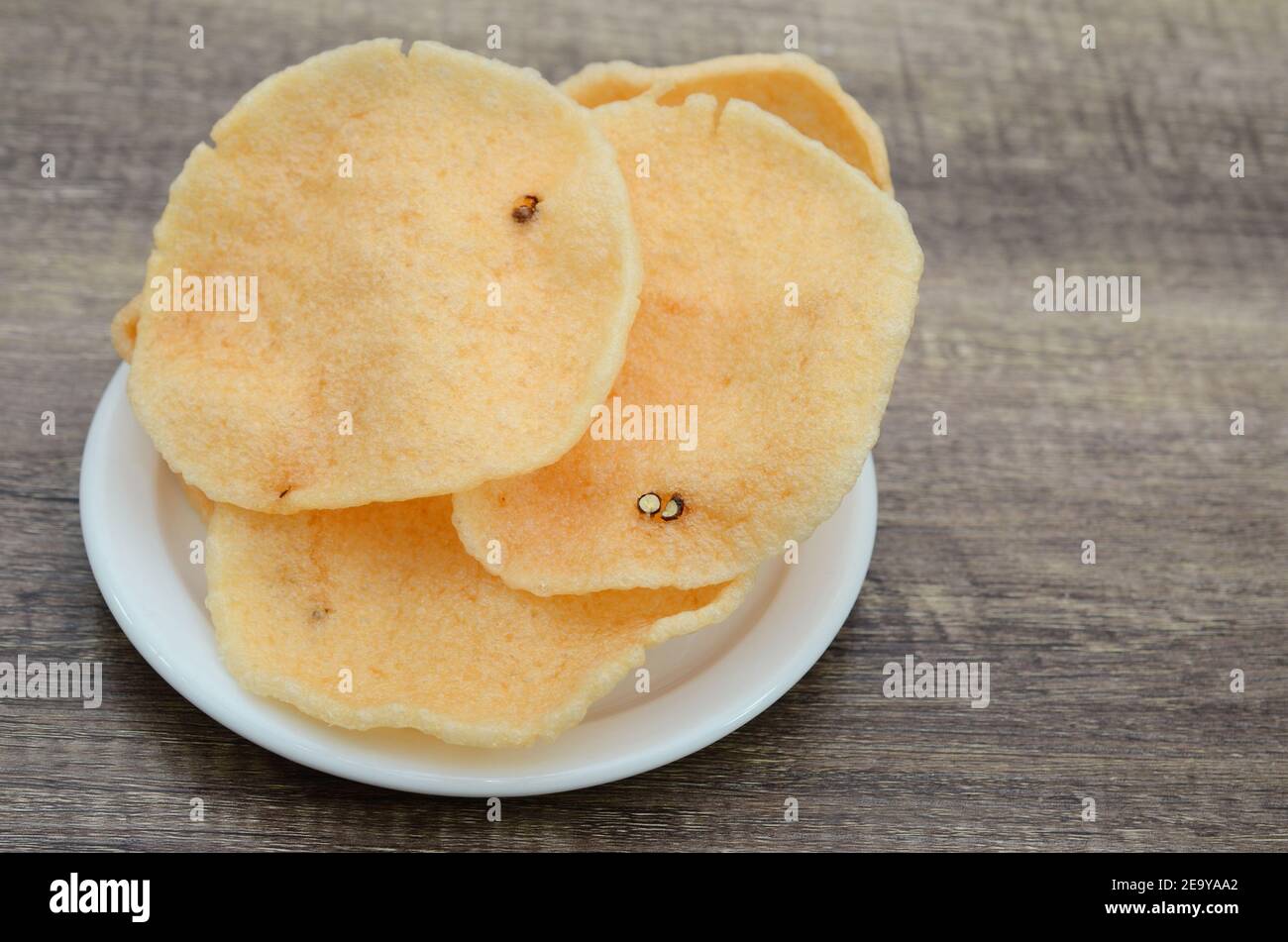 Prawn crackers in a restaurant Stock Photo - Alamy