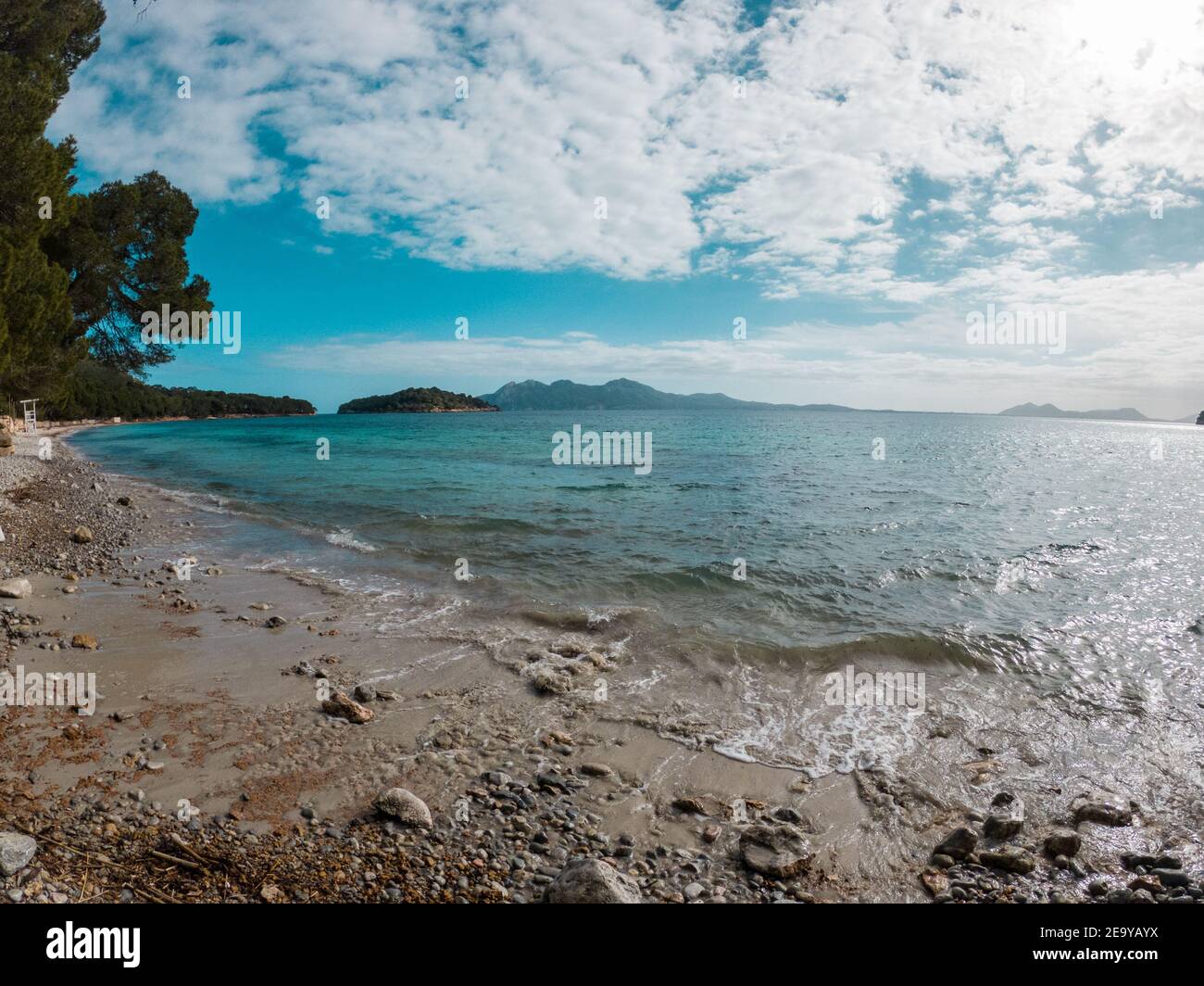 Beautiful virgin beach, withe blue water and mediterranean trees in ...