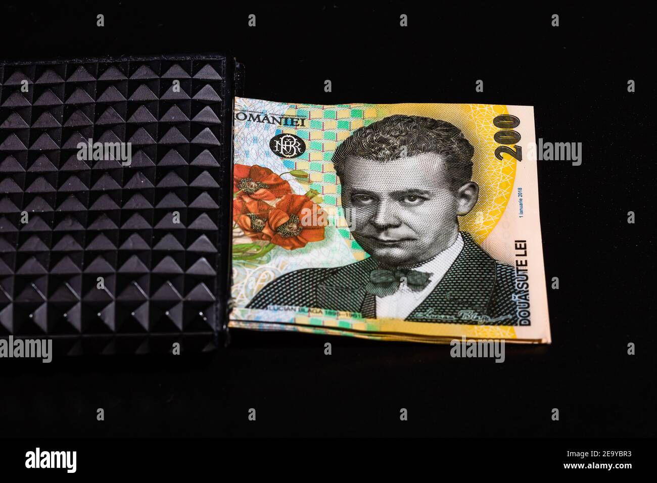 LEI romanian money banknotes in black wallet isolated Stock Photo - Alamy