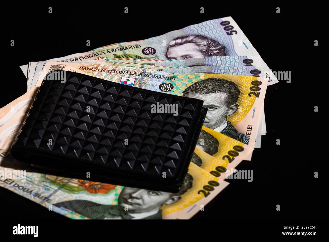 LEI romanian money banknotes in black wallet isolated Stock Photo - Alamy