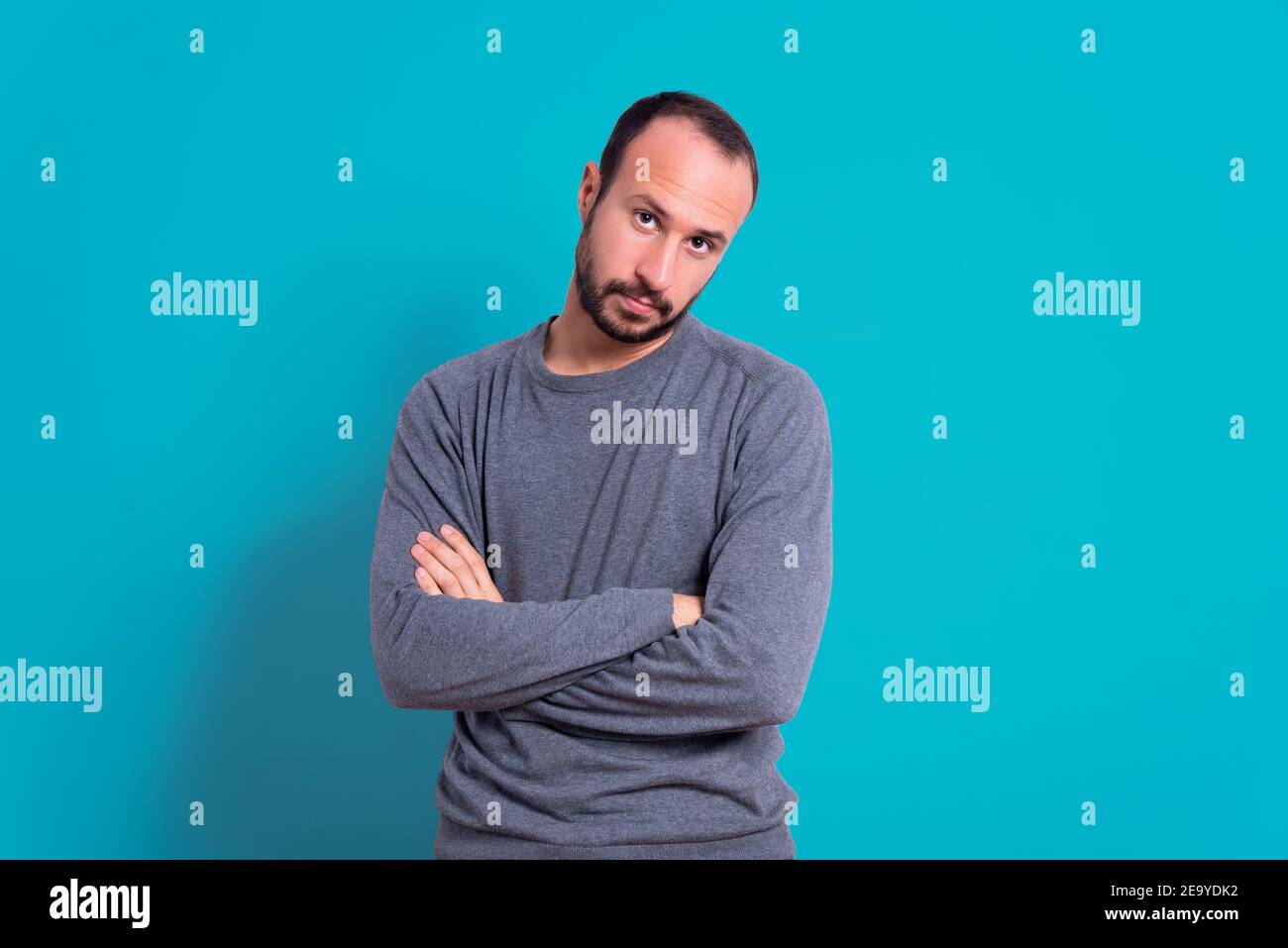 young man in casual clothes with apologetic and guilty expression ...