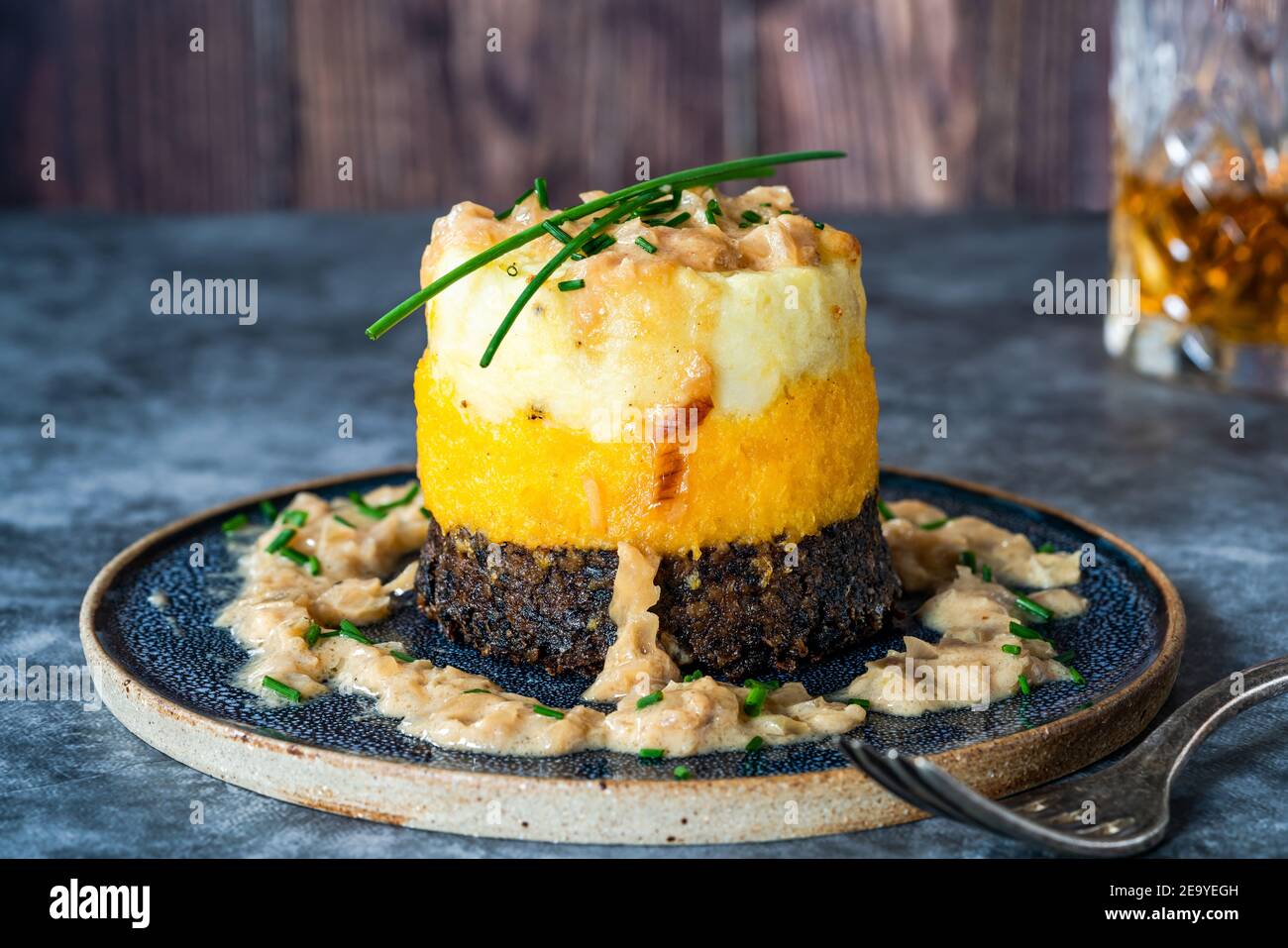 Haggis, neeps and tatties stack (haggis with turnips and potatoes) with ...