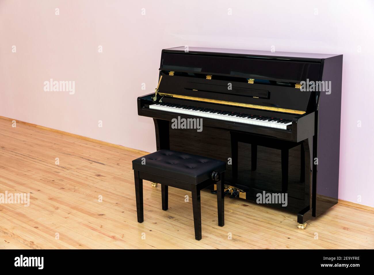 A brand new piano in the classroom. Piano training class. Music class ...