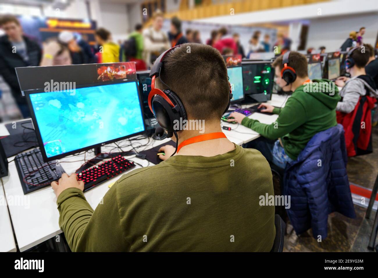 Back view on professional gamers playing MMORPG game Stock Photo - Alamy
