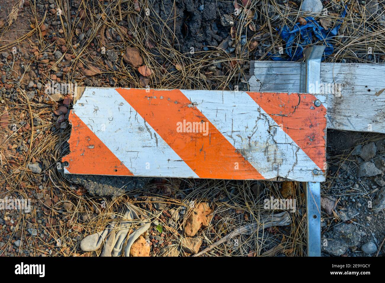Broken traffic warning sign on the ground Stock Photo - Alamy