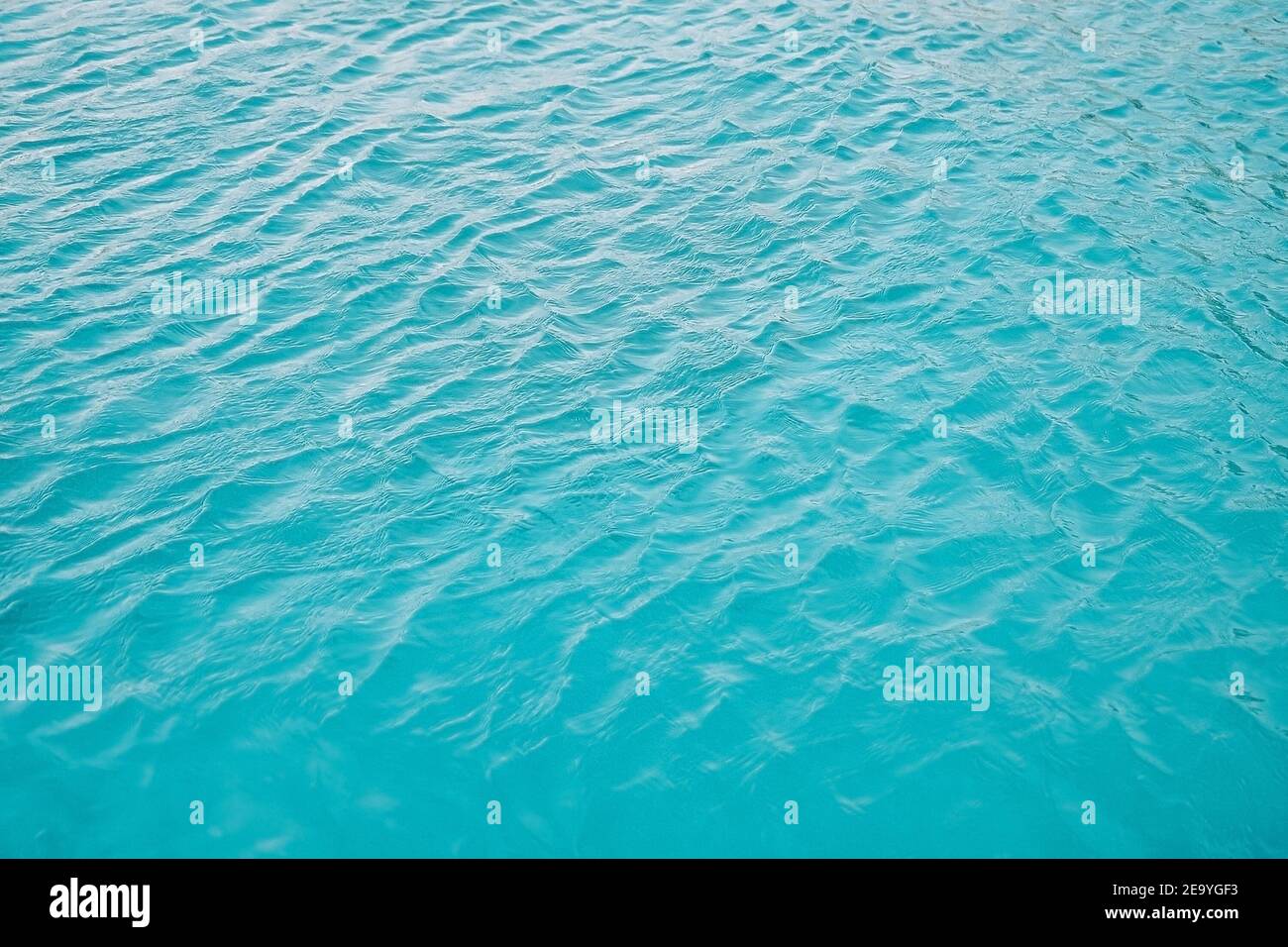 beautiful bright blue water, texture of the water surface of blue color ...