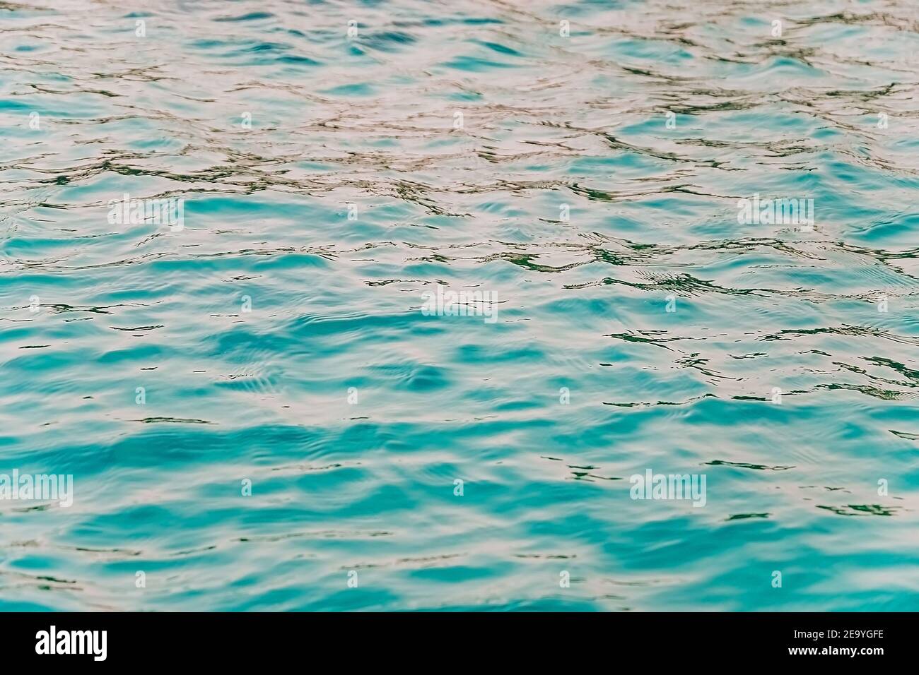 beautiful bright blue water, texture of the water surface of blue color ...