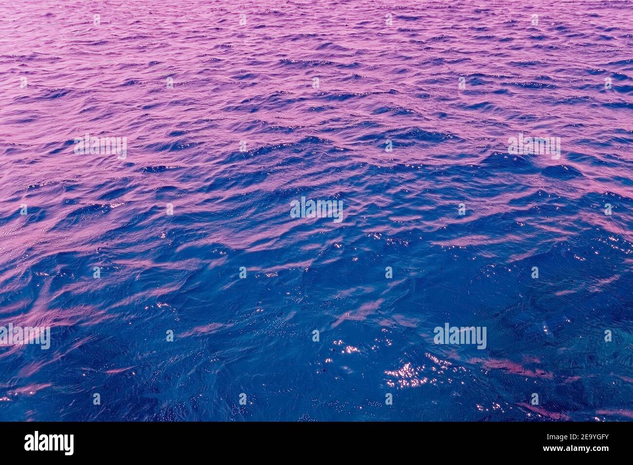 beautiful bright blue water, the texture of the water surface is purple ...