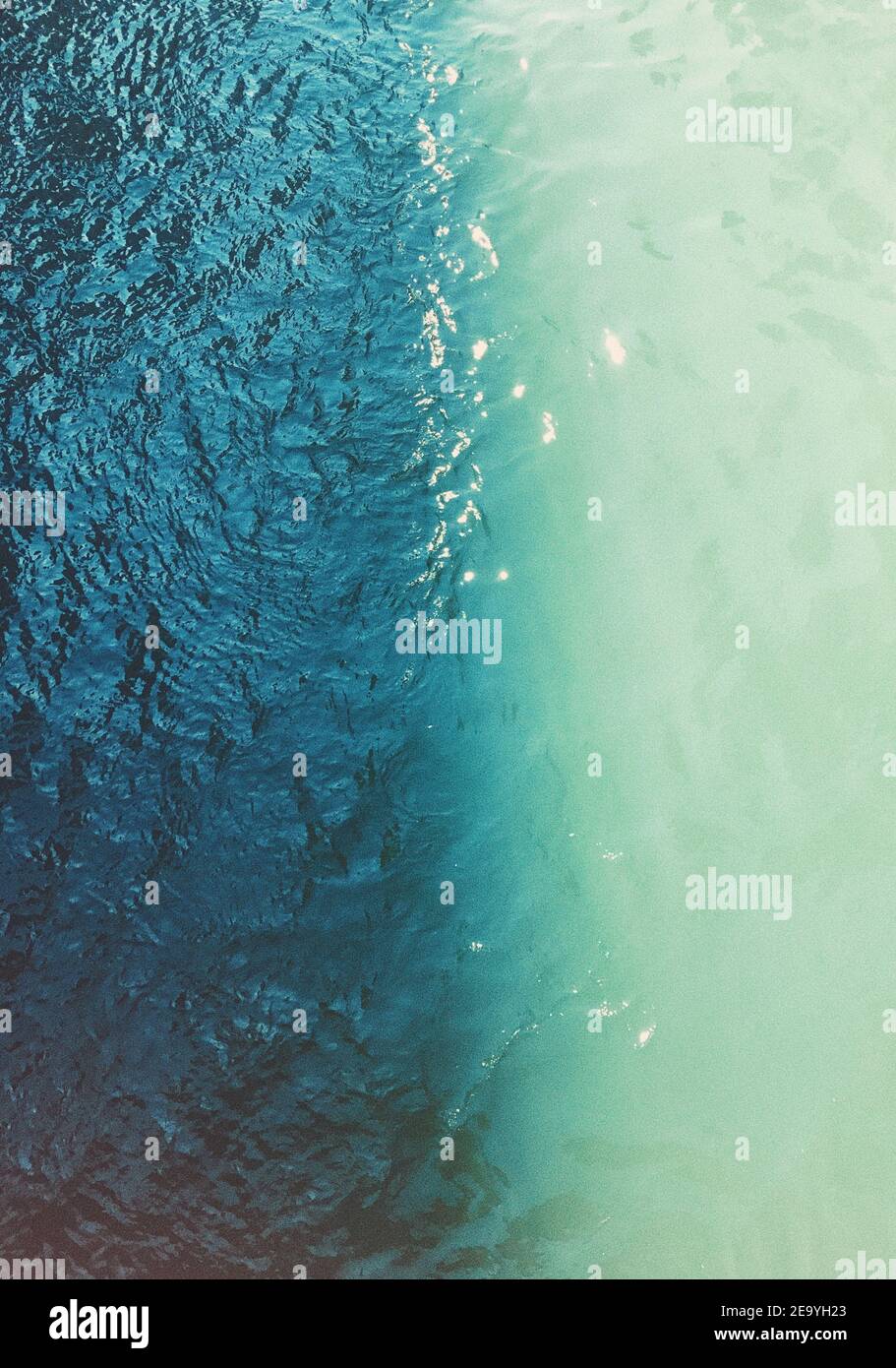 Aerial top view of waving shiny seawater in two different colors Stock ...