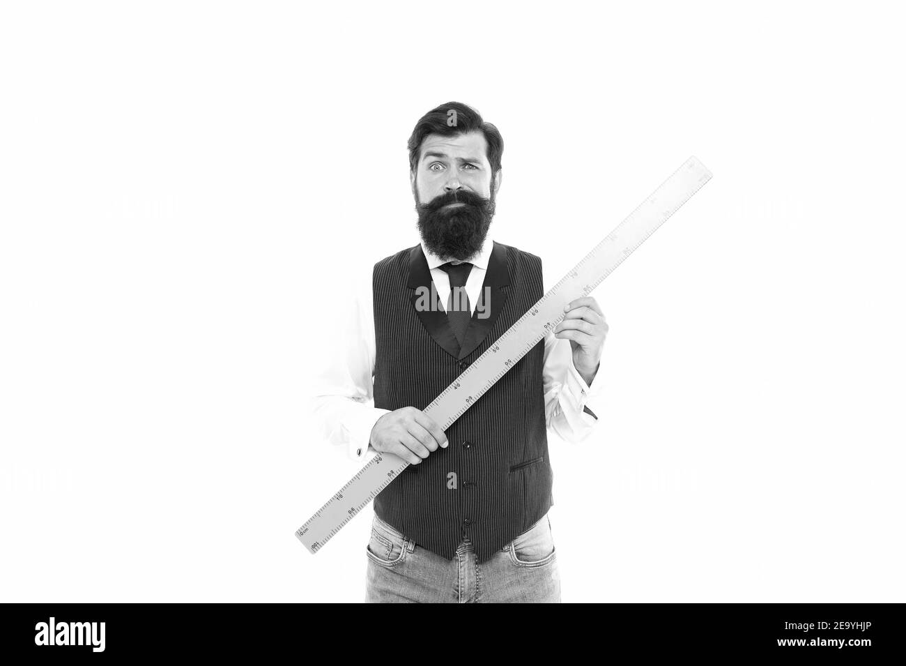 Bearded man hold ruler or line gauge for school lesson isolated on ...