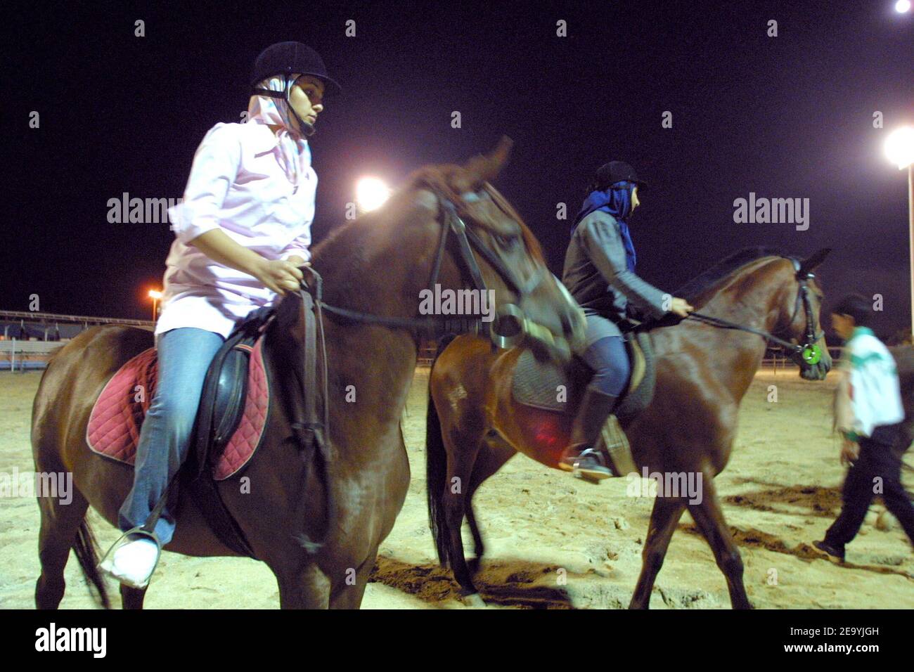 Young girls riding horses on Iran's island Kish, in the Persian Gulf ...