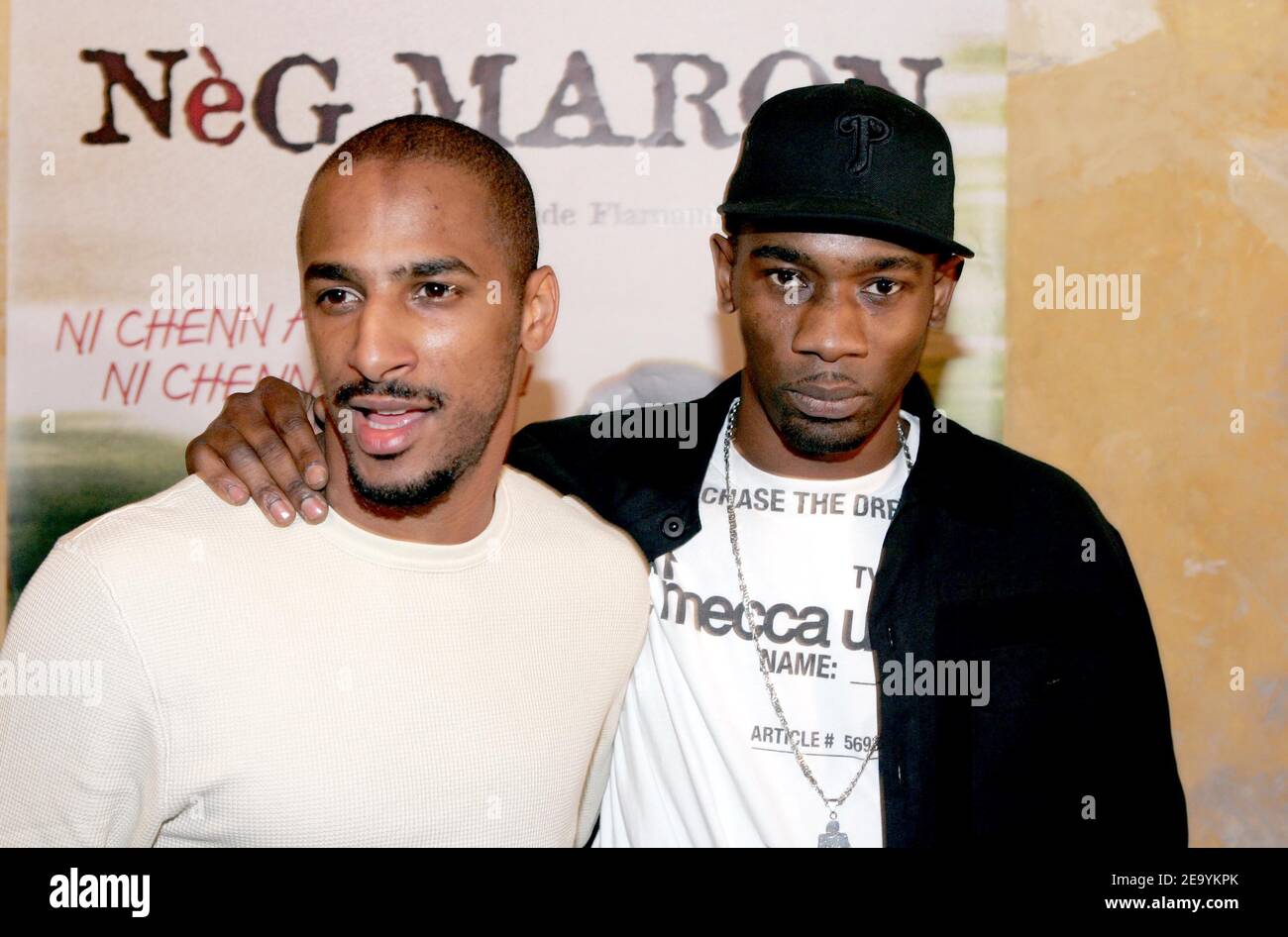 Cast member Stomy Bugsy (L) with singer Passi attends the premiere of ...