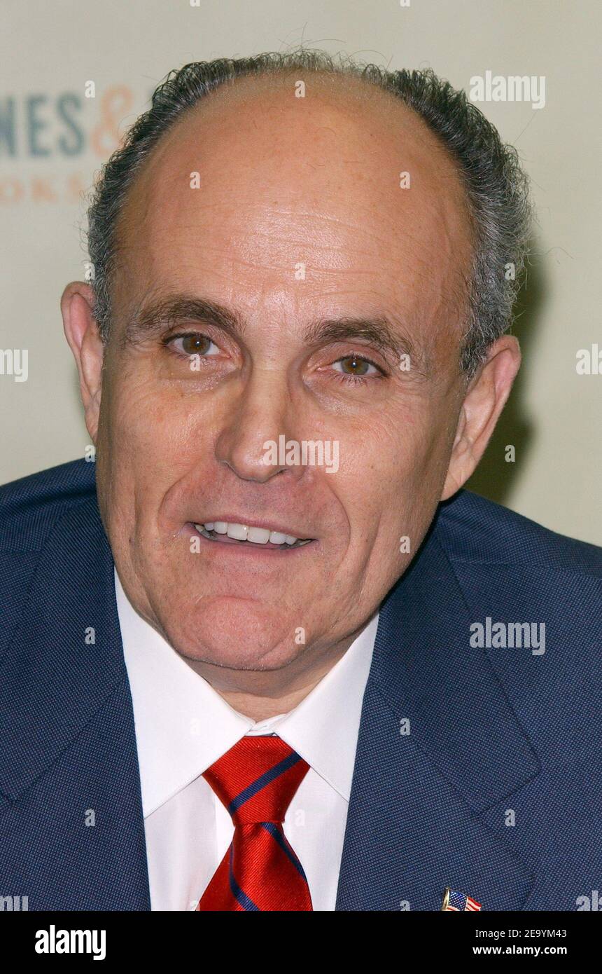 Former New York Mayor Rudy Giuliani signs copies of his book ...