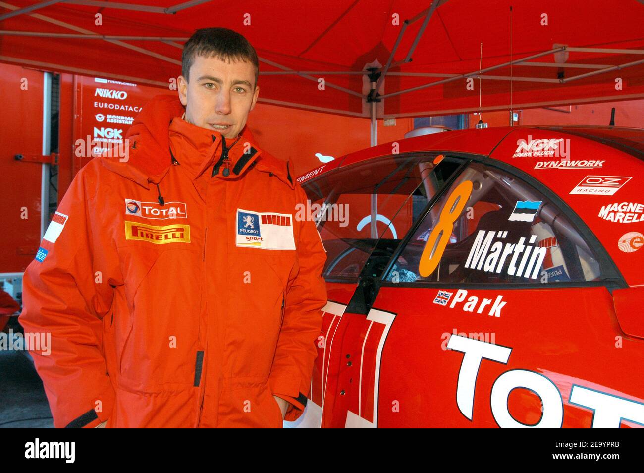 Rally driver Markko Martin of Estonia poses next to his Peugeot 307 WRC ...