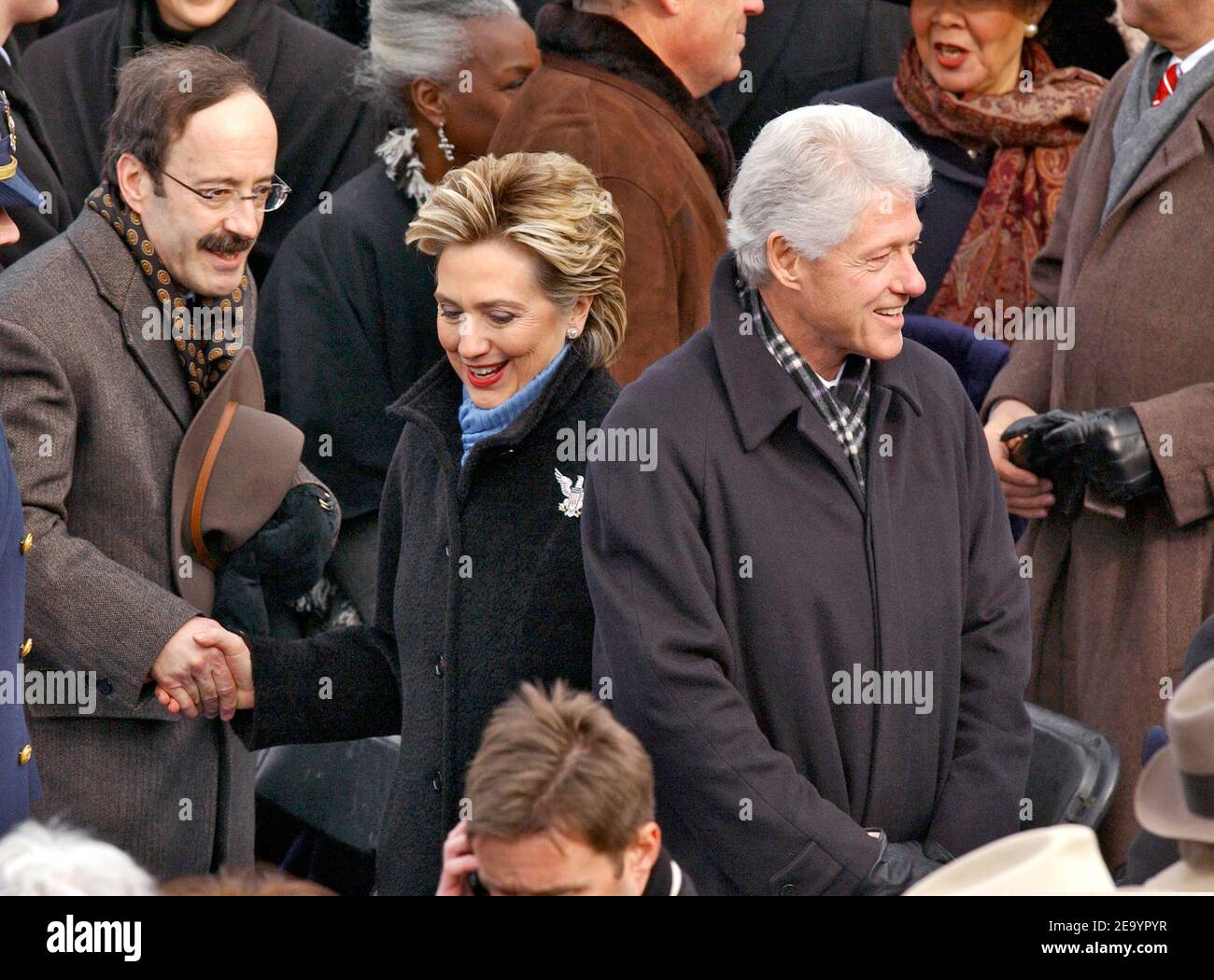 Senator Hillary Clinton and former President Bill Clinton greet others ...