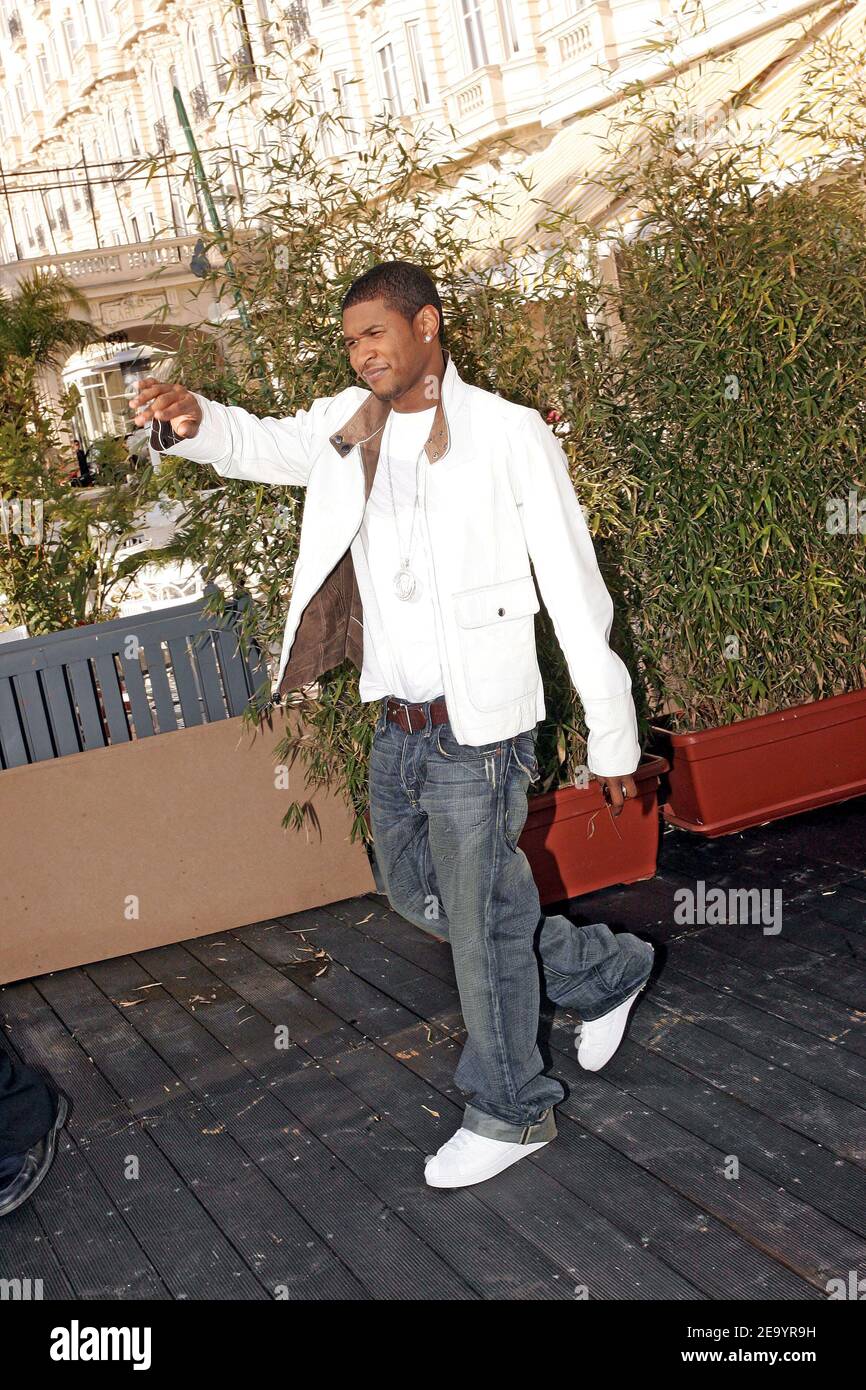 US rap singer Usher poses for the photographers before the opening of ...