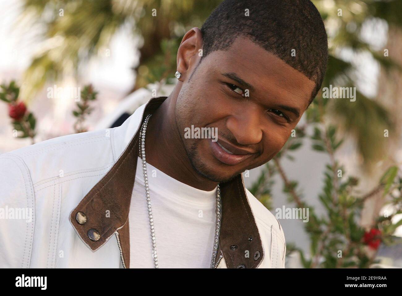 US rap singer Usher poses for the photographers before the opening of ...