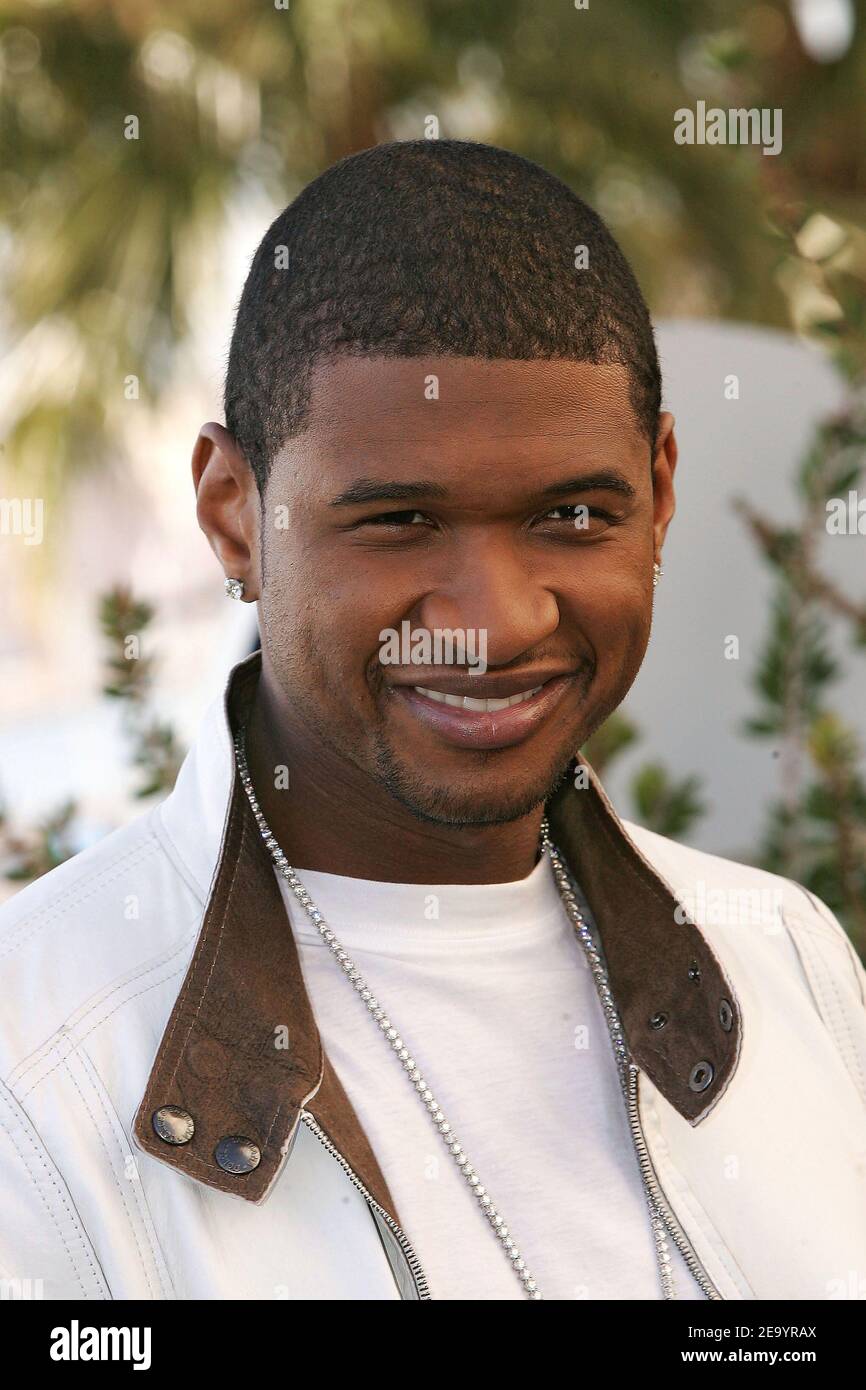 US rap singer Usher poses for the photographers before the opening of ...