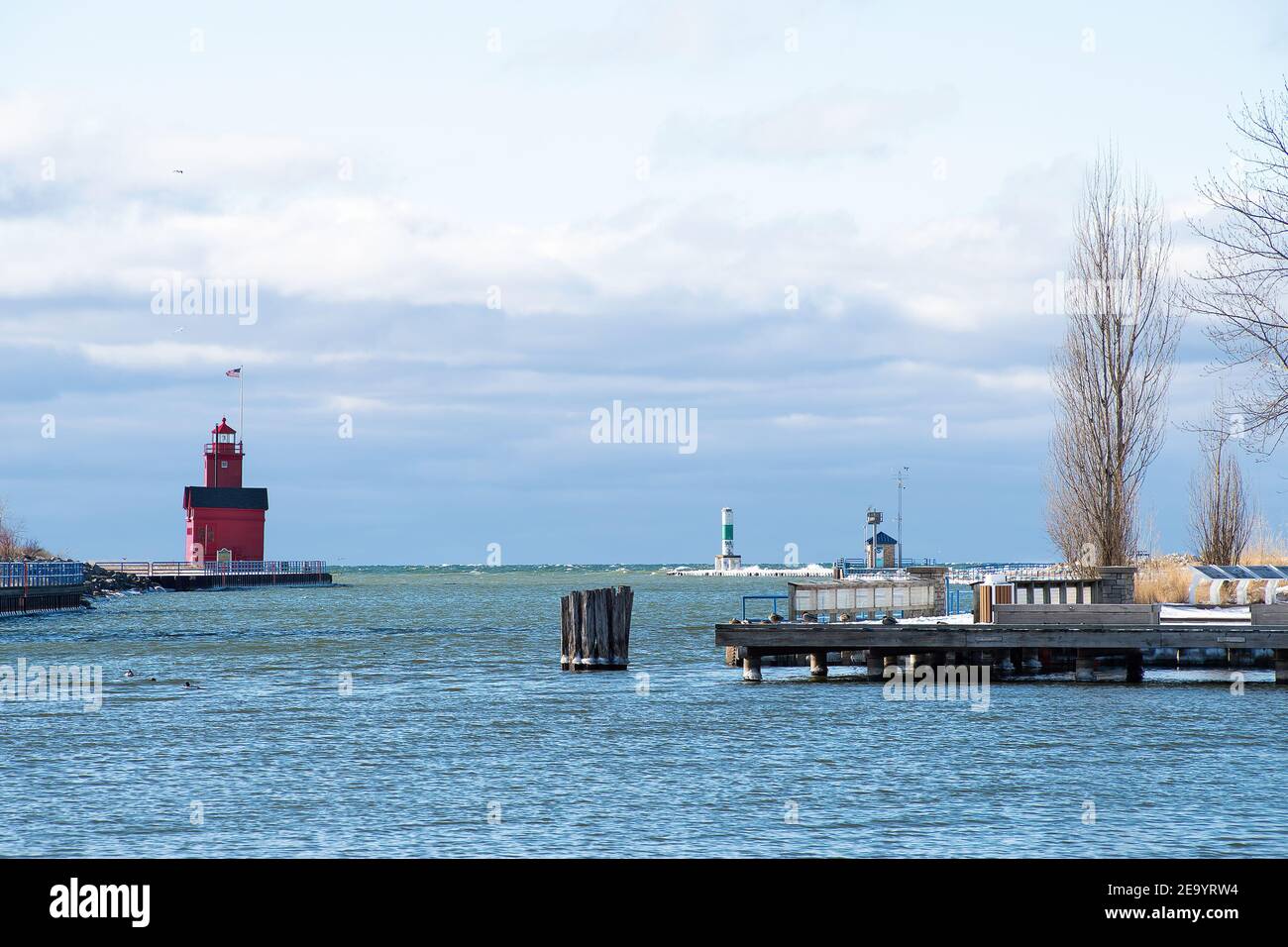 Red lighthouse in Holland Michigan harbor in winter Stock Photo - Alamy