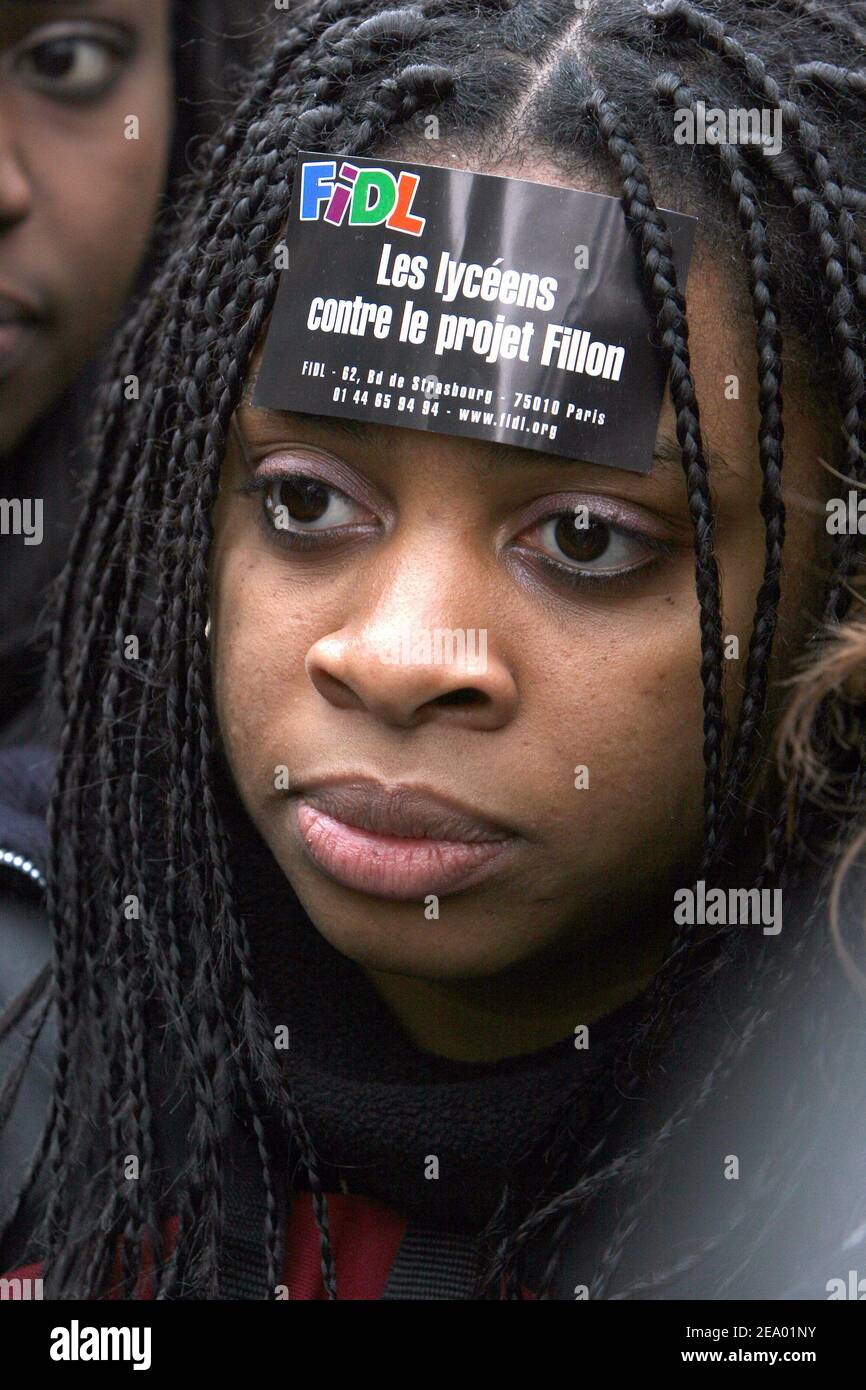 French high school students parade near banners as they shout protest ...