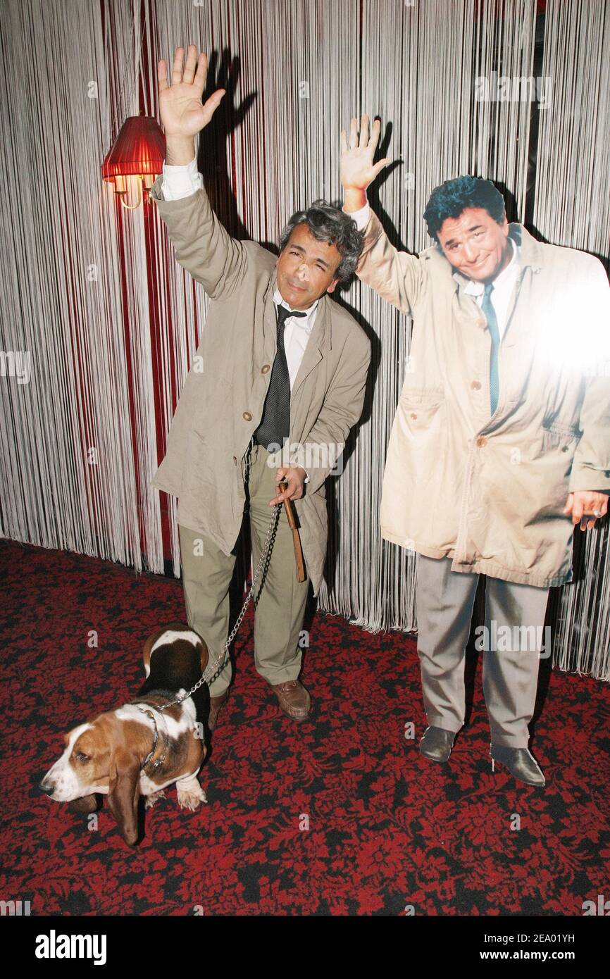 Peter Falk's look alike Alain Lekler poses by a picture of Peter Falk ...