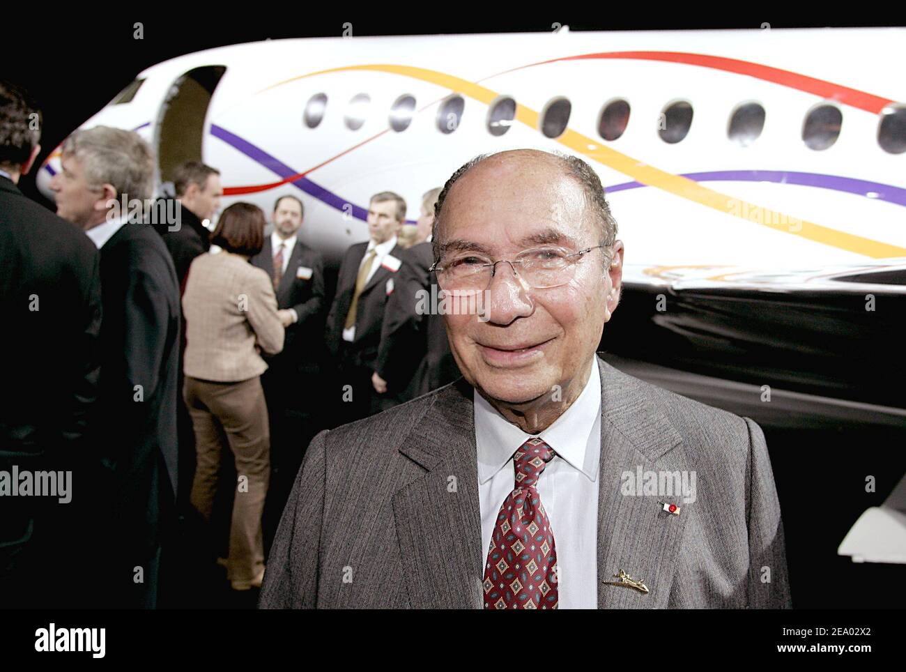 Dassault Aviation CEO Serge Dassault poses in front of the new Falcon ...
