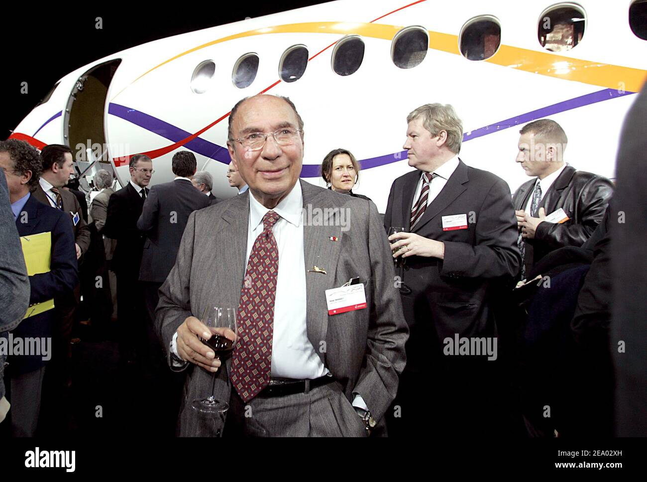 Dassault Aviation CEO Serge Dassault poses in front of the new Falcon ...