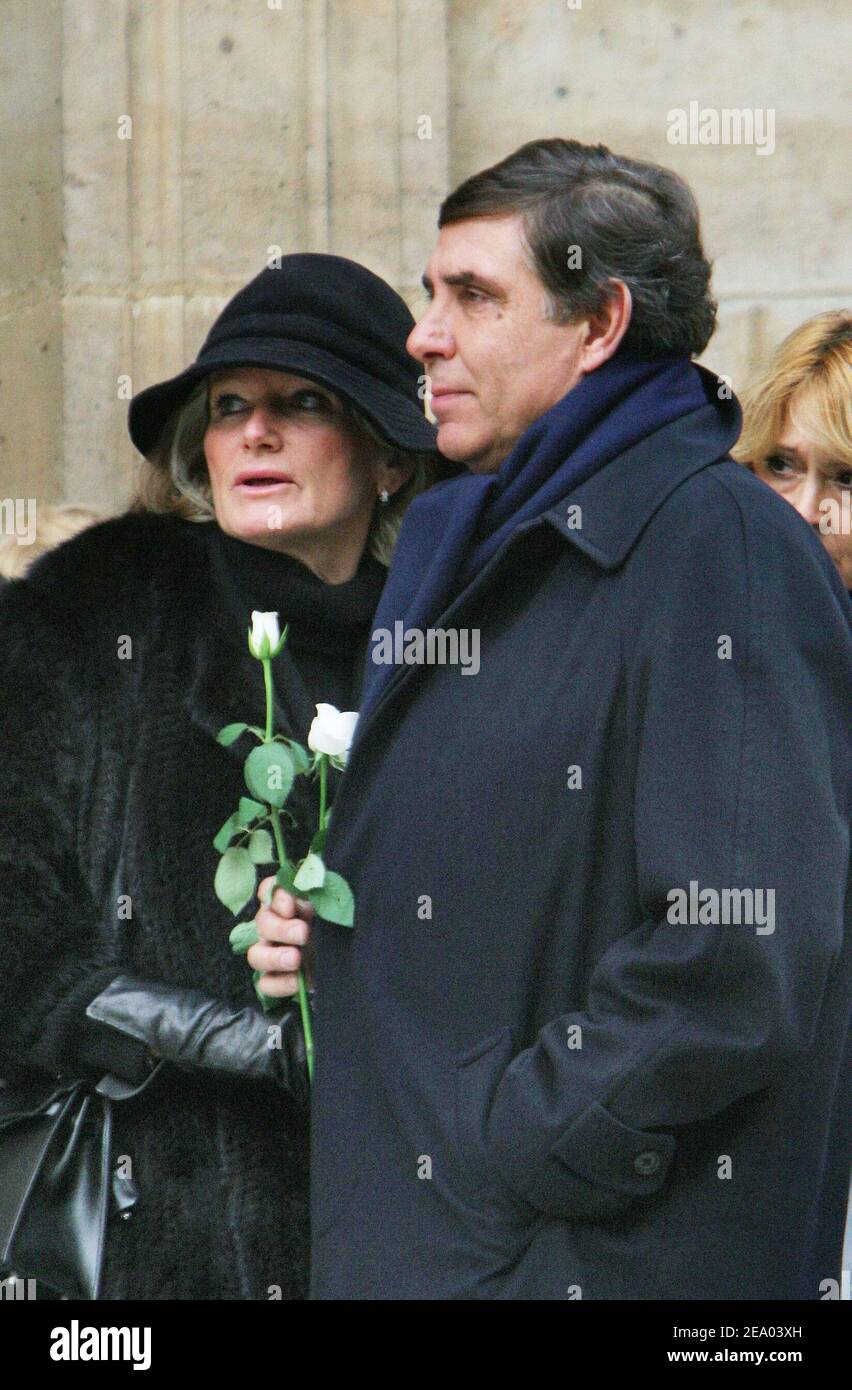 French TV presenter Jean-Pierre Foucault and his wife Evelyne leaving ...