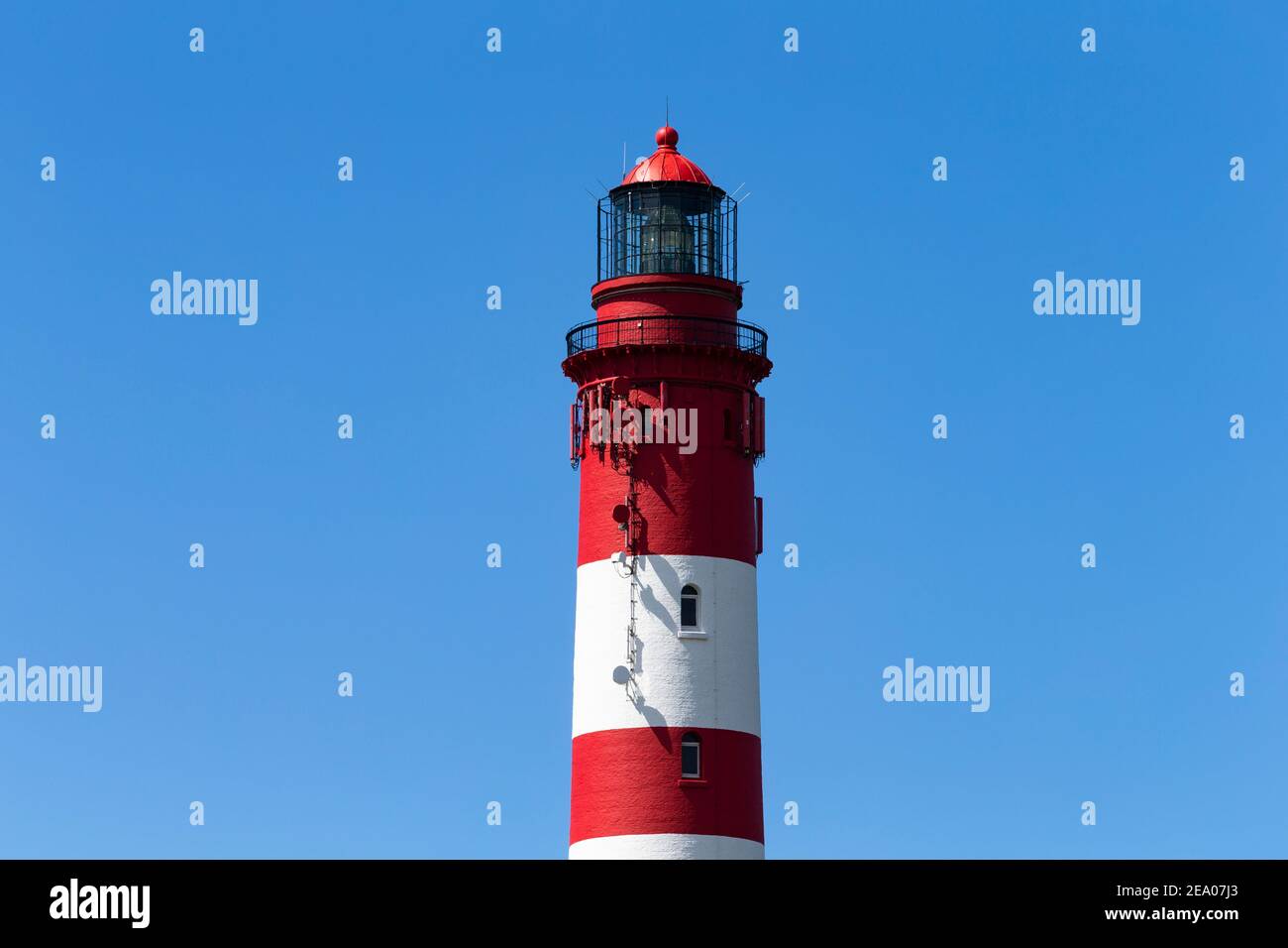 The photo shows a detail of the Amrum lighthouse with blue sky Stock ...