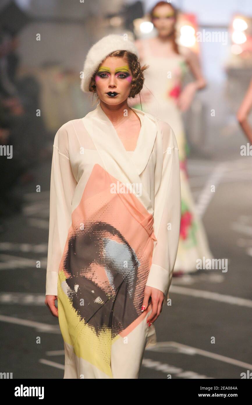 A model wears a creation by British fashion designer John Galliano for ...
